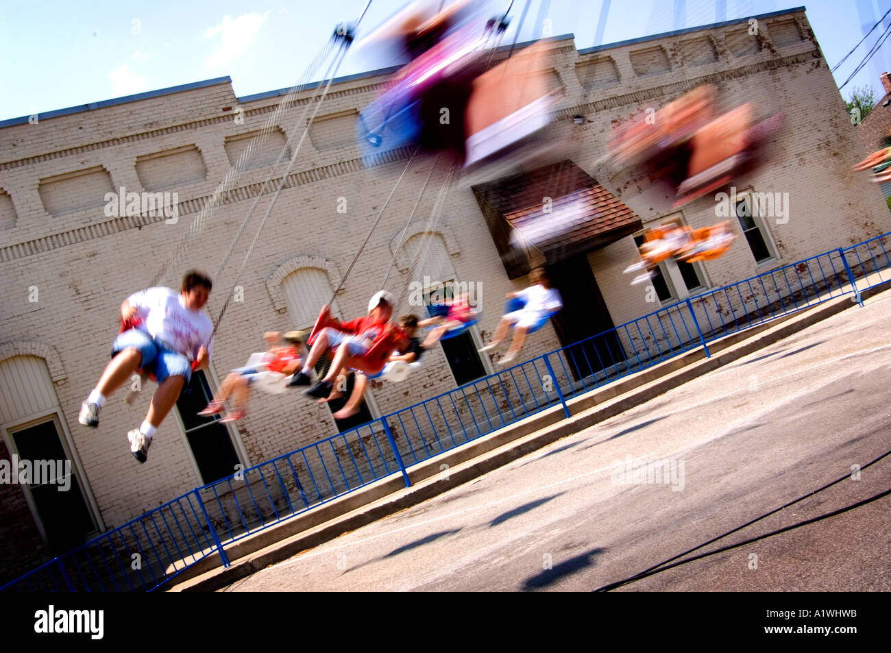 Kids on carnival ride Stock Photo - Alamy