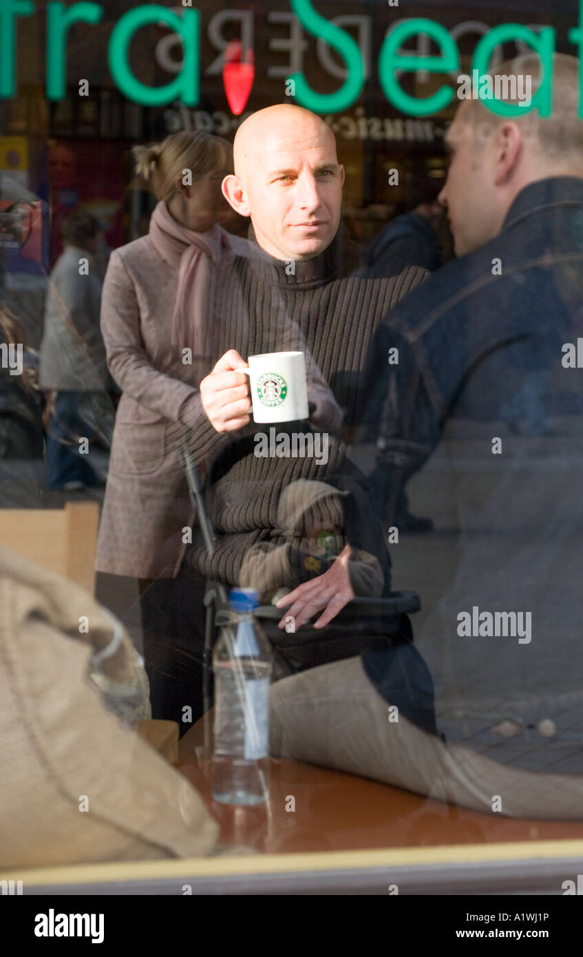 Man drinking coffee in Starbucks Leeds West Yorkshire England UK Europe ...