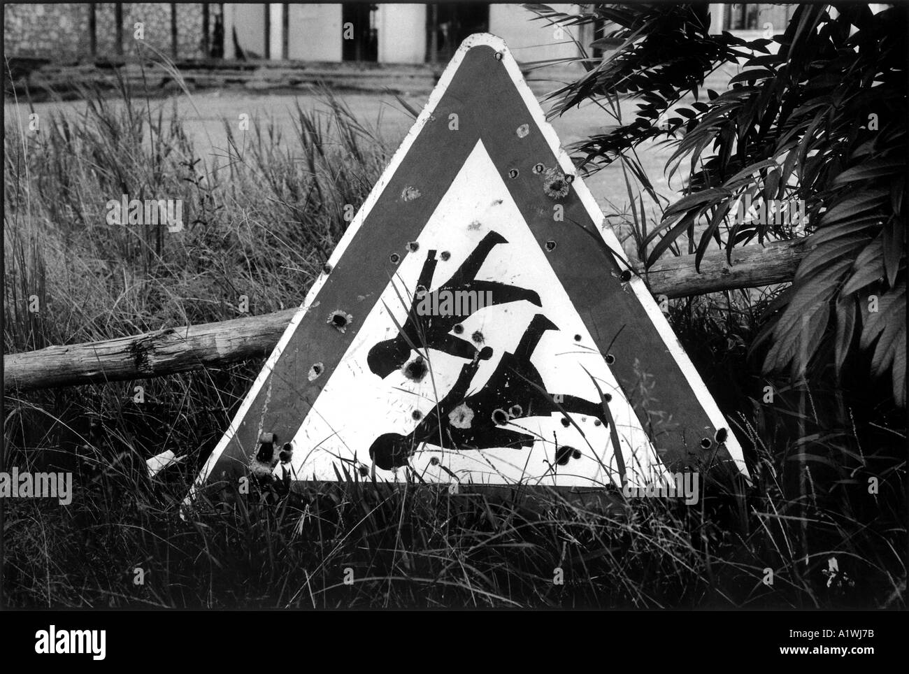 Rwanda Kigali 1994 Bullet hole ridden school sign Stock Photo - Alamy