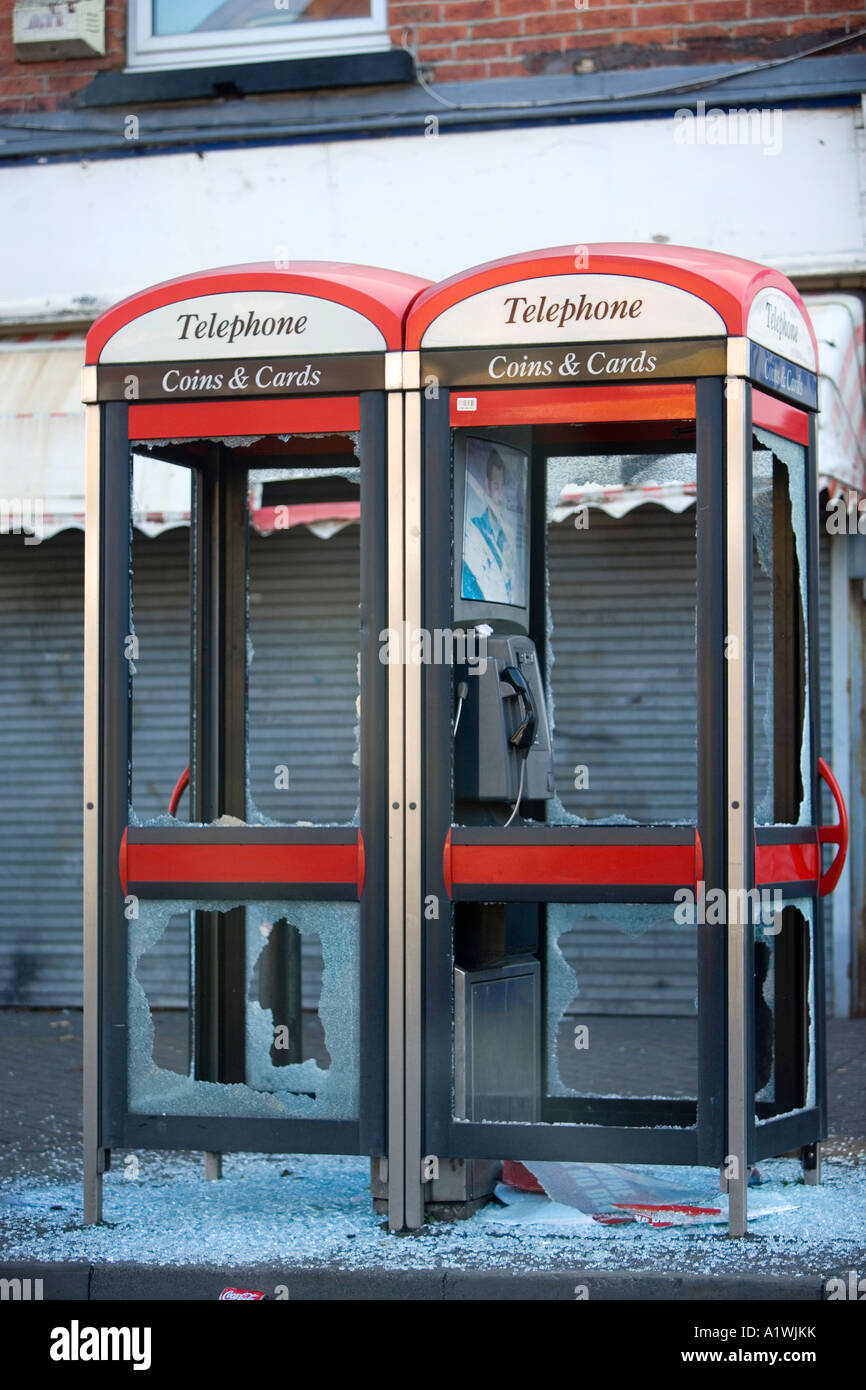 Vandalised telephone phone box with broken glass windows in Beeston ...