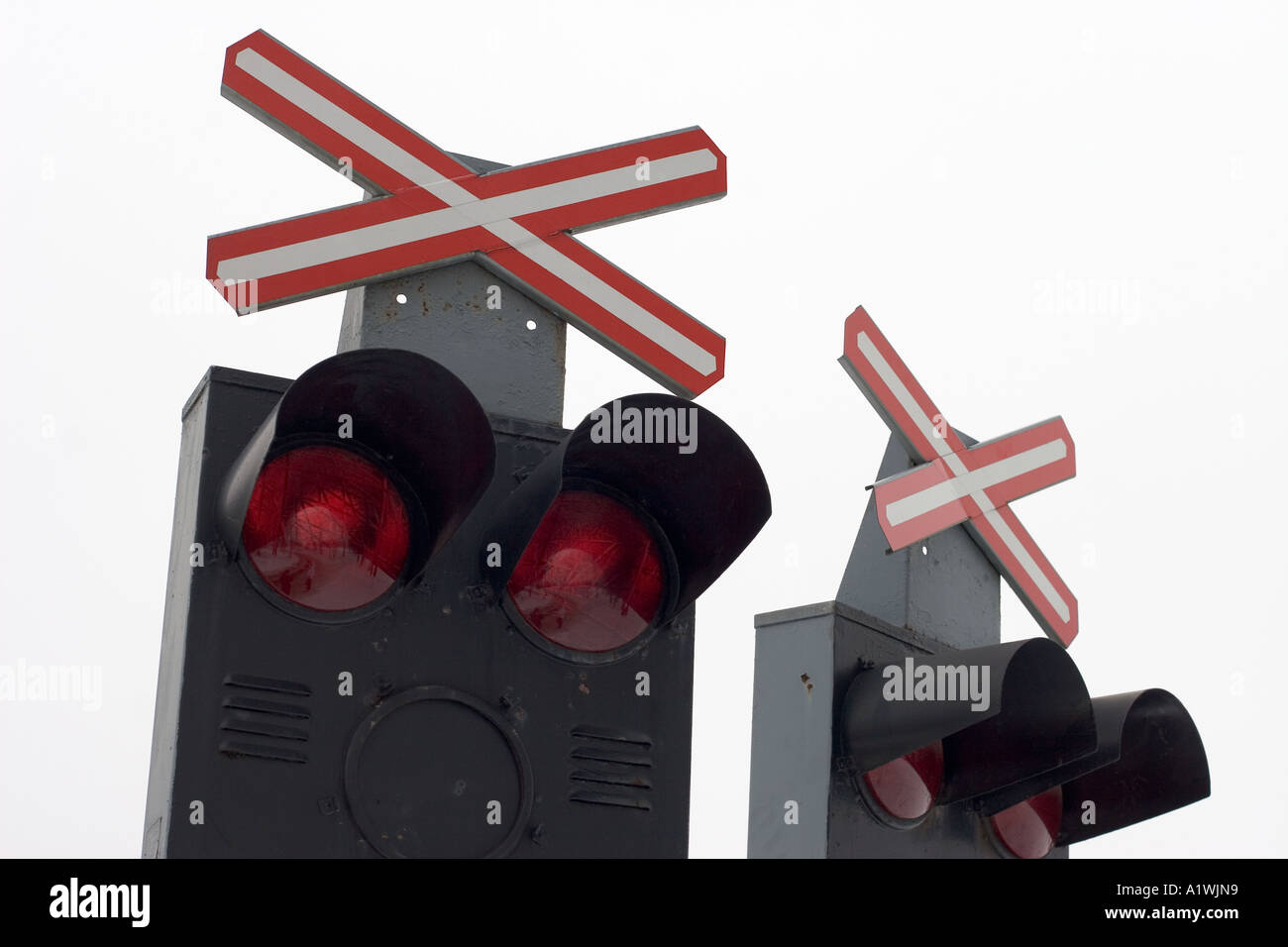 Traffic sign St. Andrew's Cross with traffic lights at an electrified ...