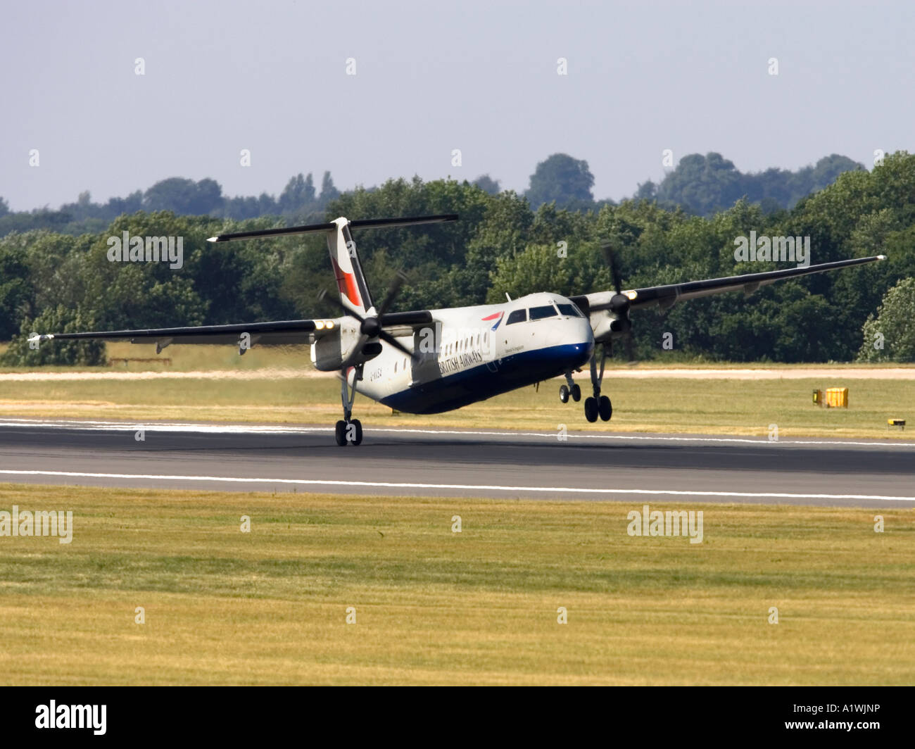 BA British Airways Dash 8 landing in a crosswind wind shear Stock Photo ...