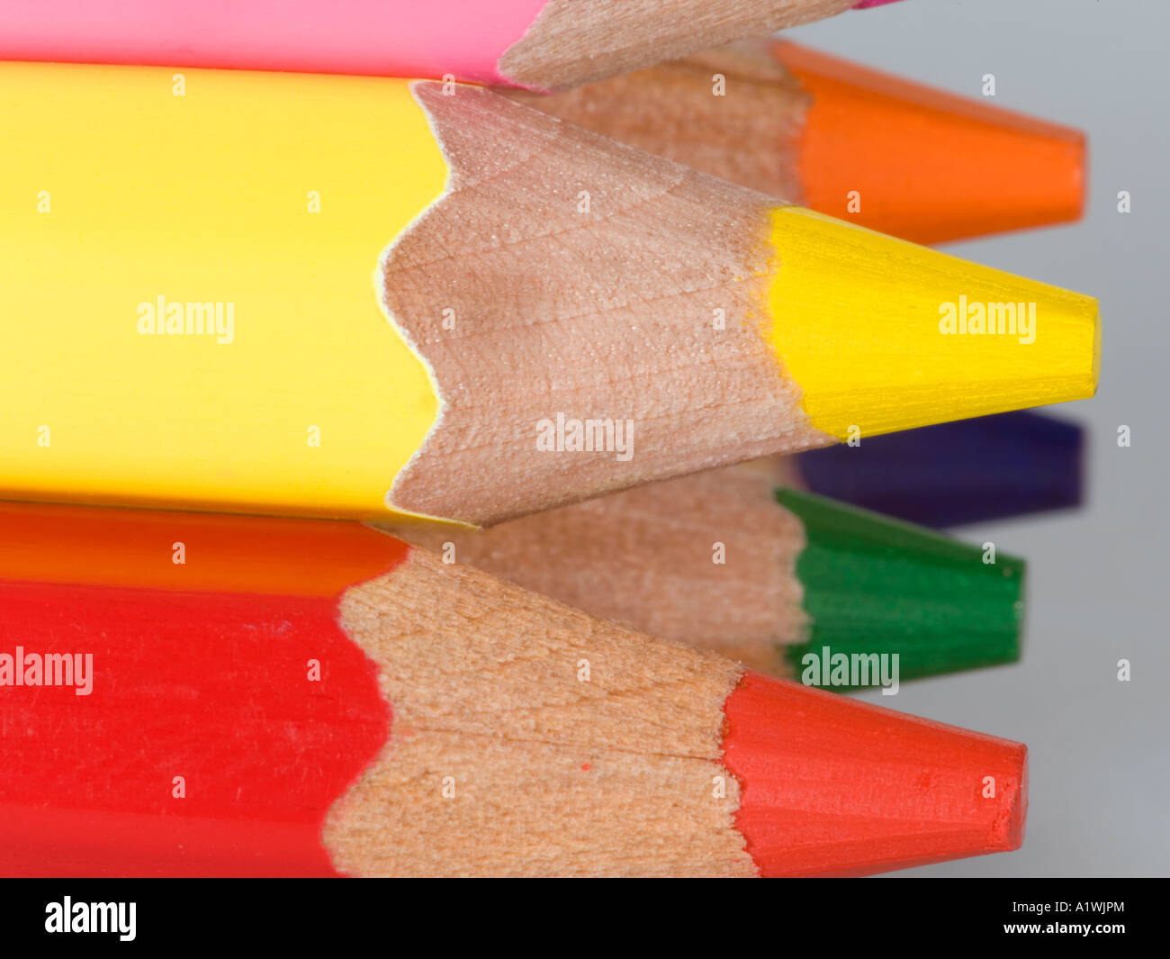 six coloured pencils stacked on each other Stock Photo - Alamy