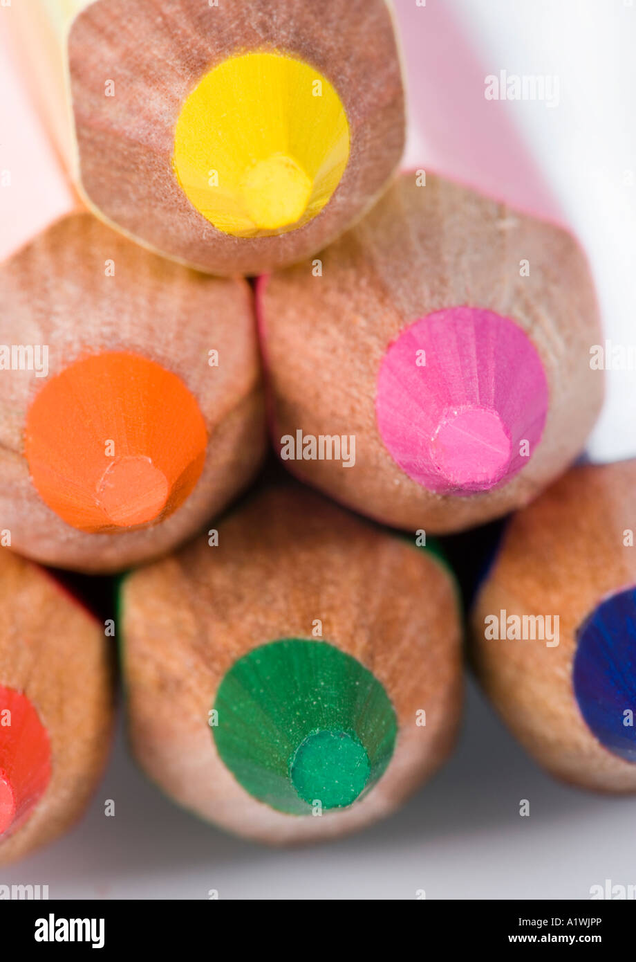 six coloured pencils stacked on each other Stock Photo - Alamy