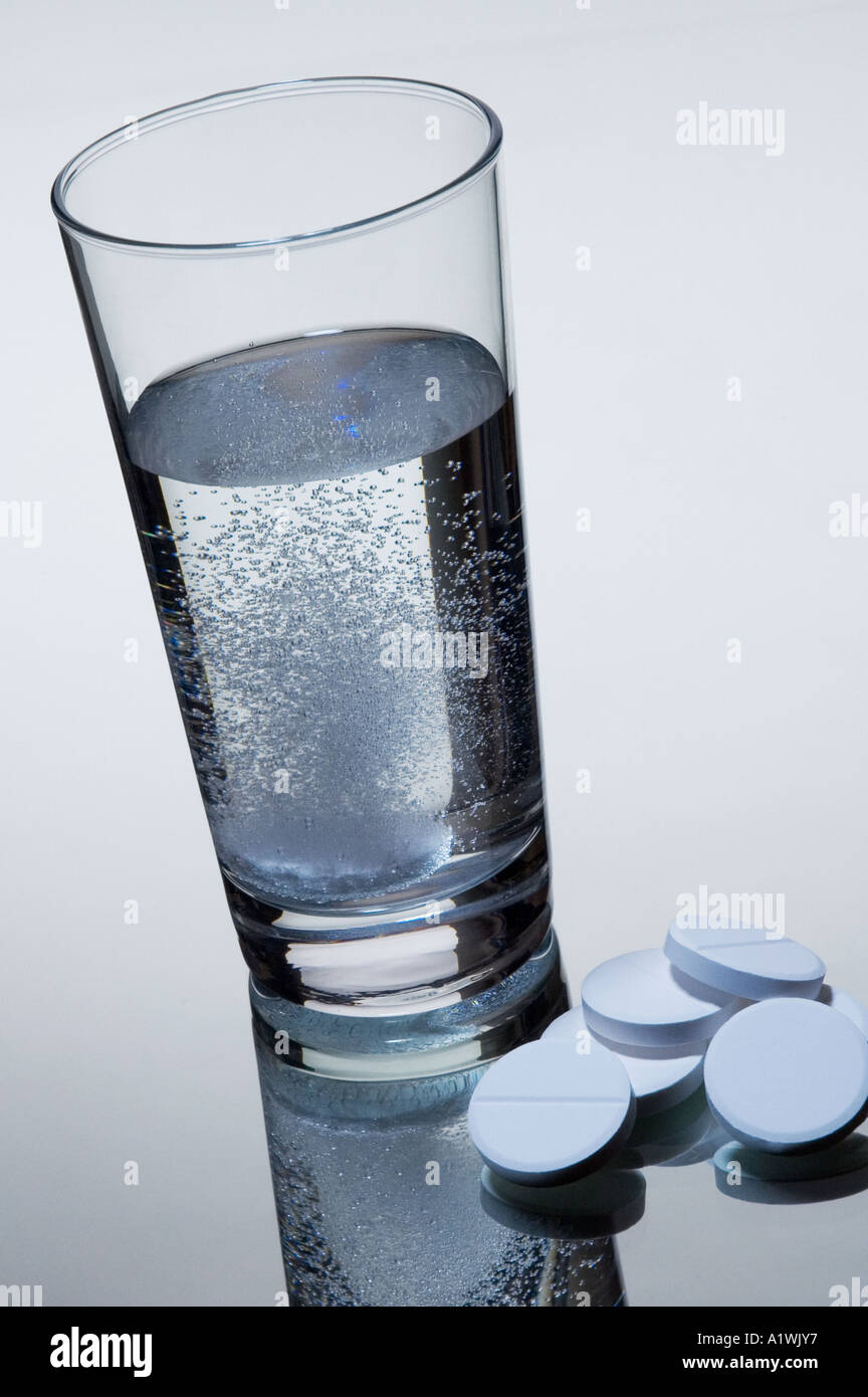 TABLET ON A GLASS OF WATER Stock Photo - Alamy