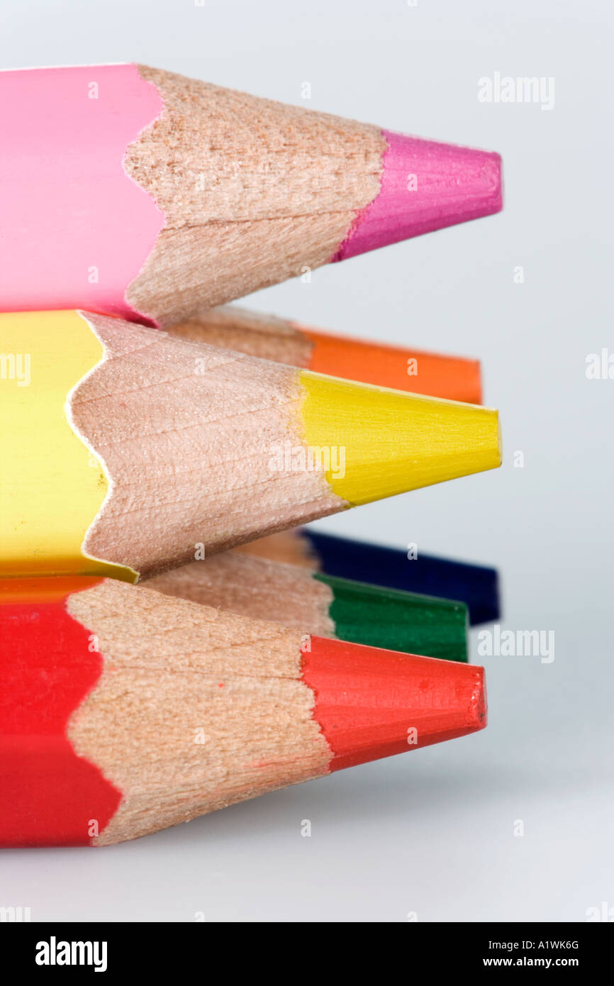 Six coloured pencils stacked on each other Stock Photo - Alamy