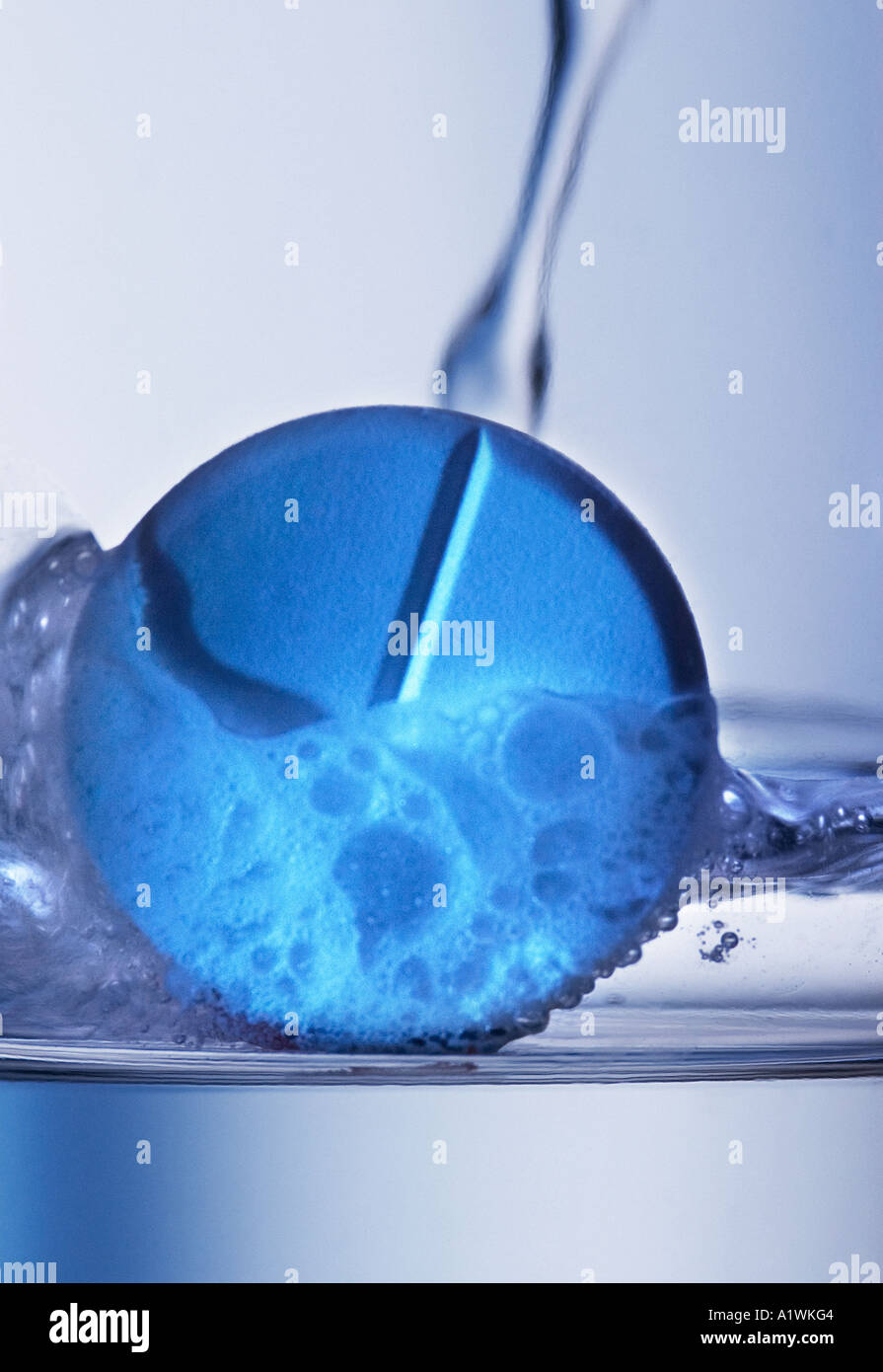 TABLET ON A GLASS OF WATER Stock Photo - Alamy