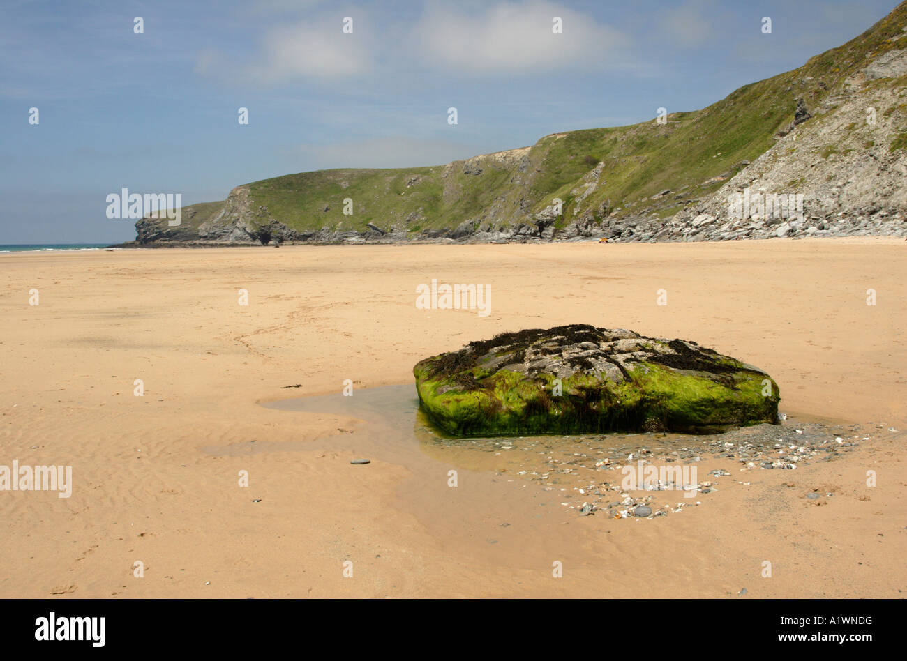 Rock on beach by cliffs Watergate bay Cornwall England UK Stock Photo ...