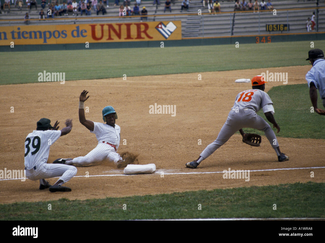 CUBA . PLAYER MAKES SAFE SLIDE TO BASE DURING BALLPARK BASEBALL GAME ...