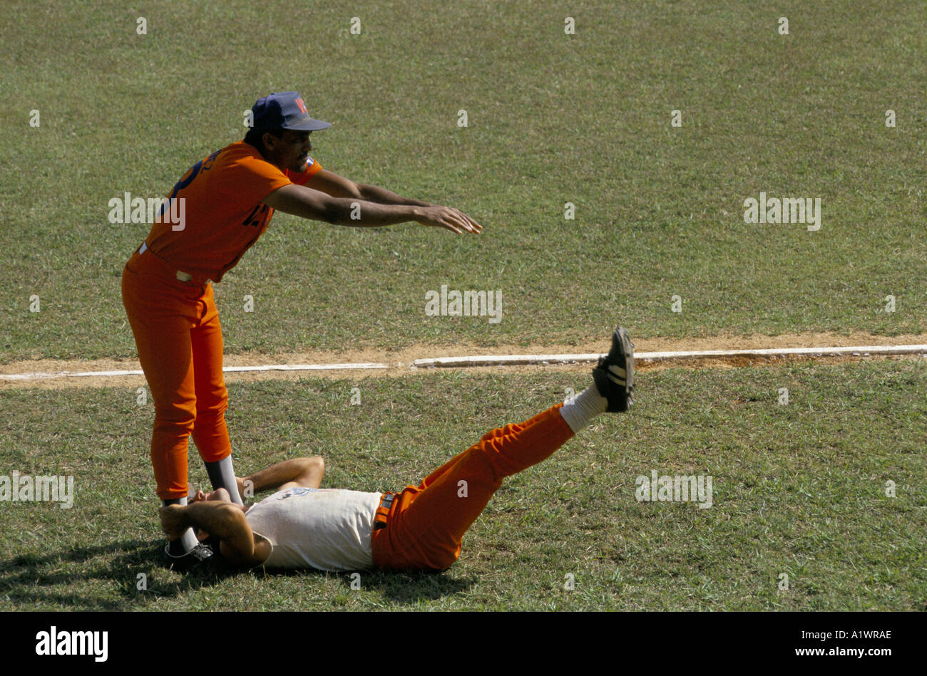 CUBA . BALLPARK BALLET. TWO BASEBALL PLAYERS COMBINE TO HELP EACH OTHER ...