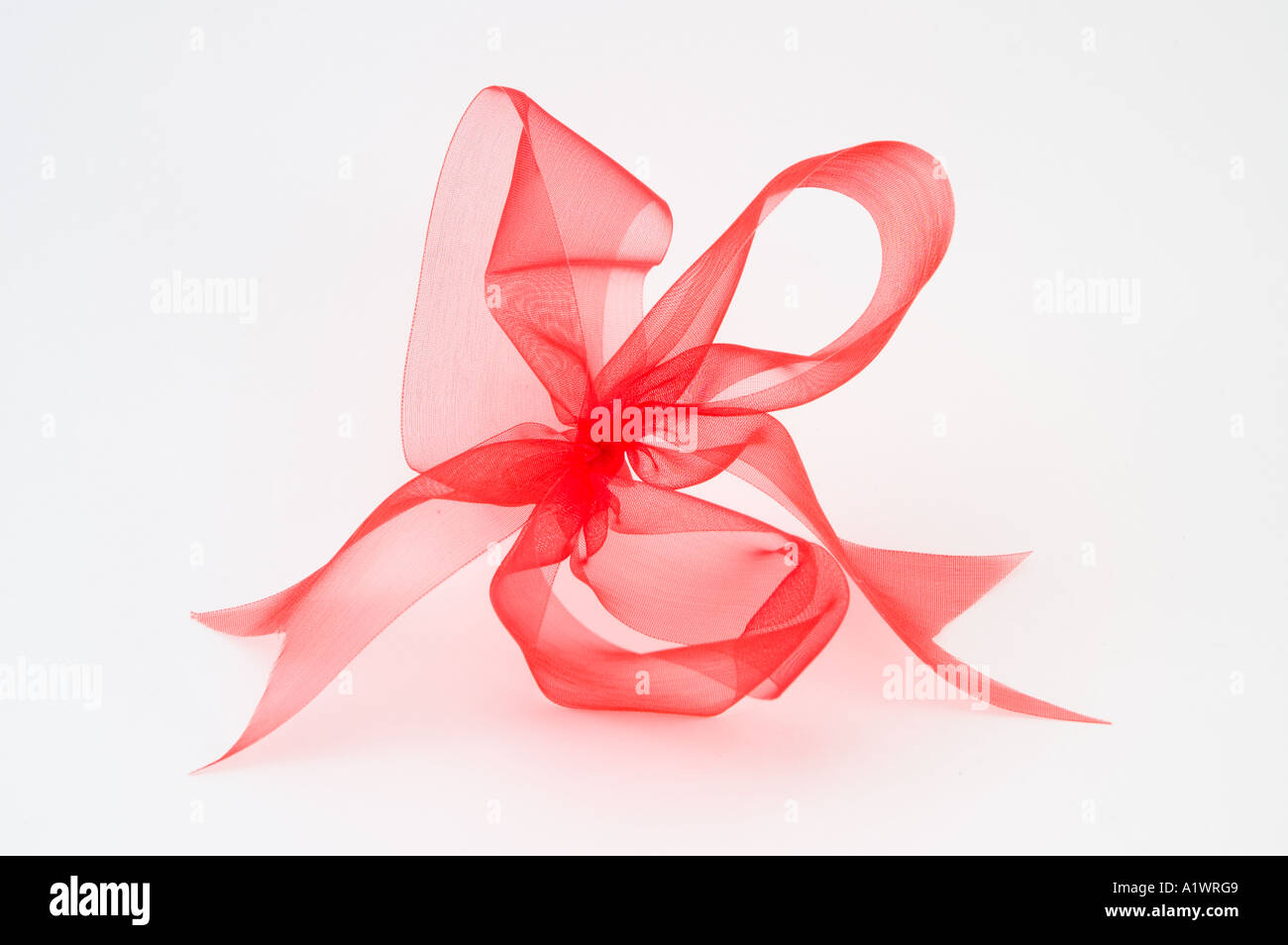 A red ribbon bow Stock Photo - Alamy