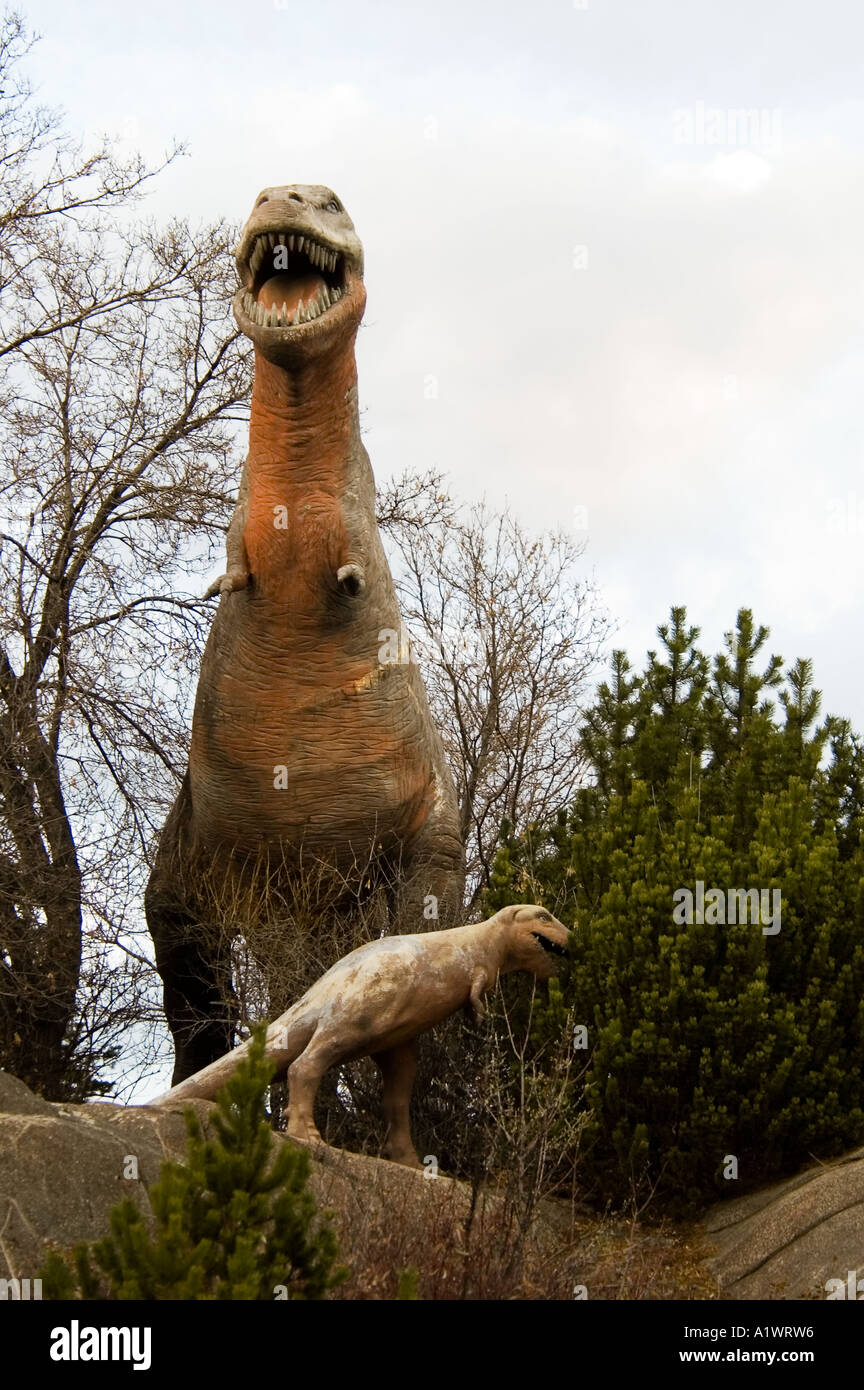A replica of a dinosaur and its young at the Calgary Zoo Prehistoric ...