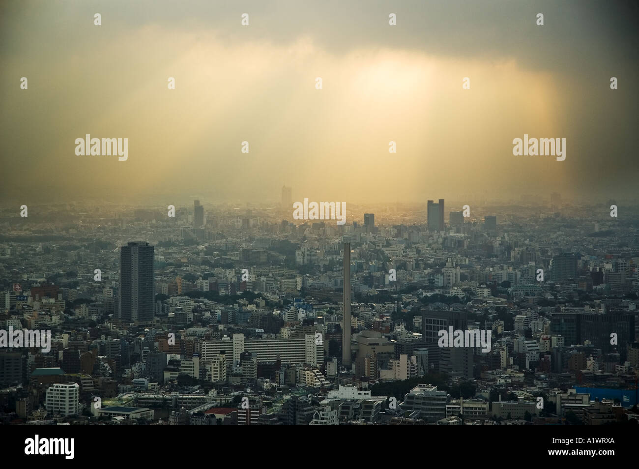A sunbeam breaks through the clouds over the Tokyo skyline in a view ...