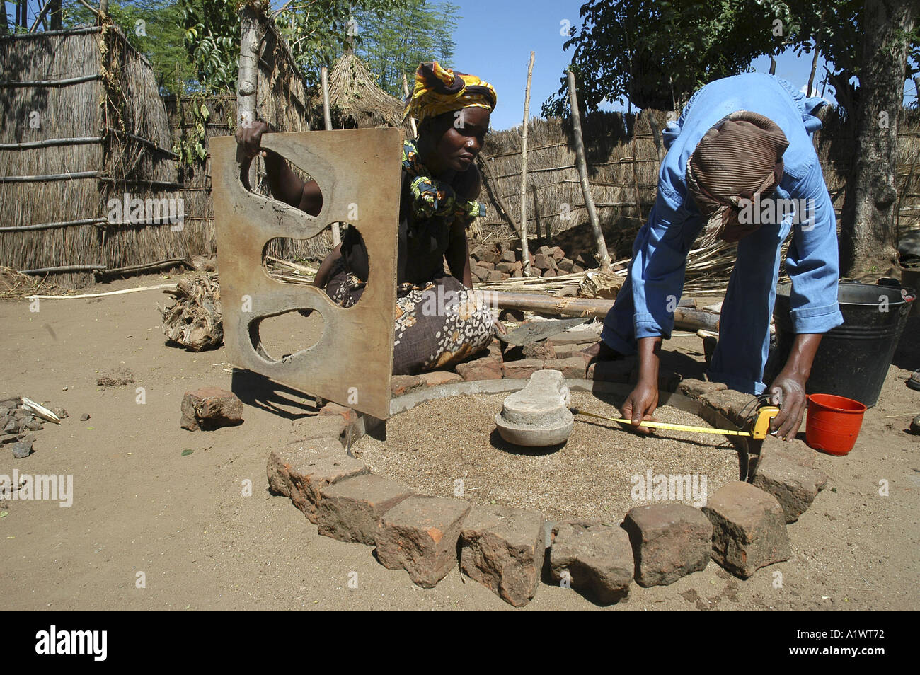 Women from sanitation committee making latrines in order to raise ...