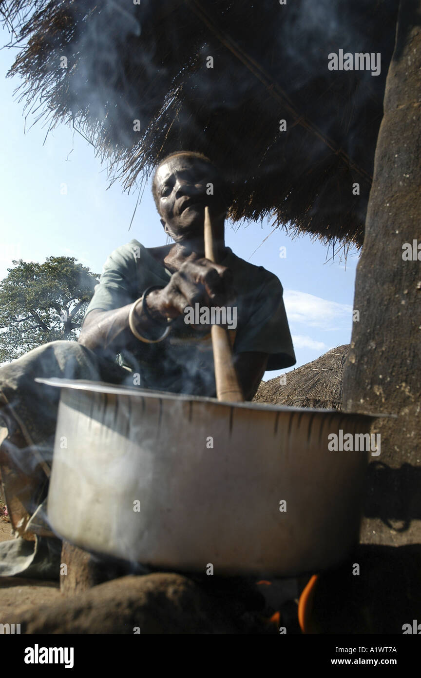 Rural home woman cooking on open fire near Salima Stock Photo - Alamy