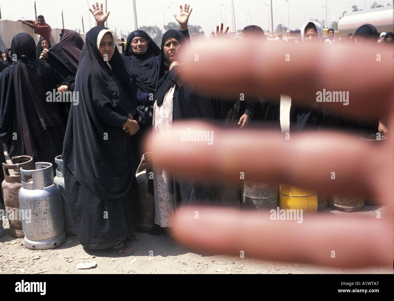 Angry Iraqi women queuing for propane gas in extreme heat This is used ...