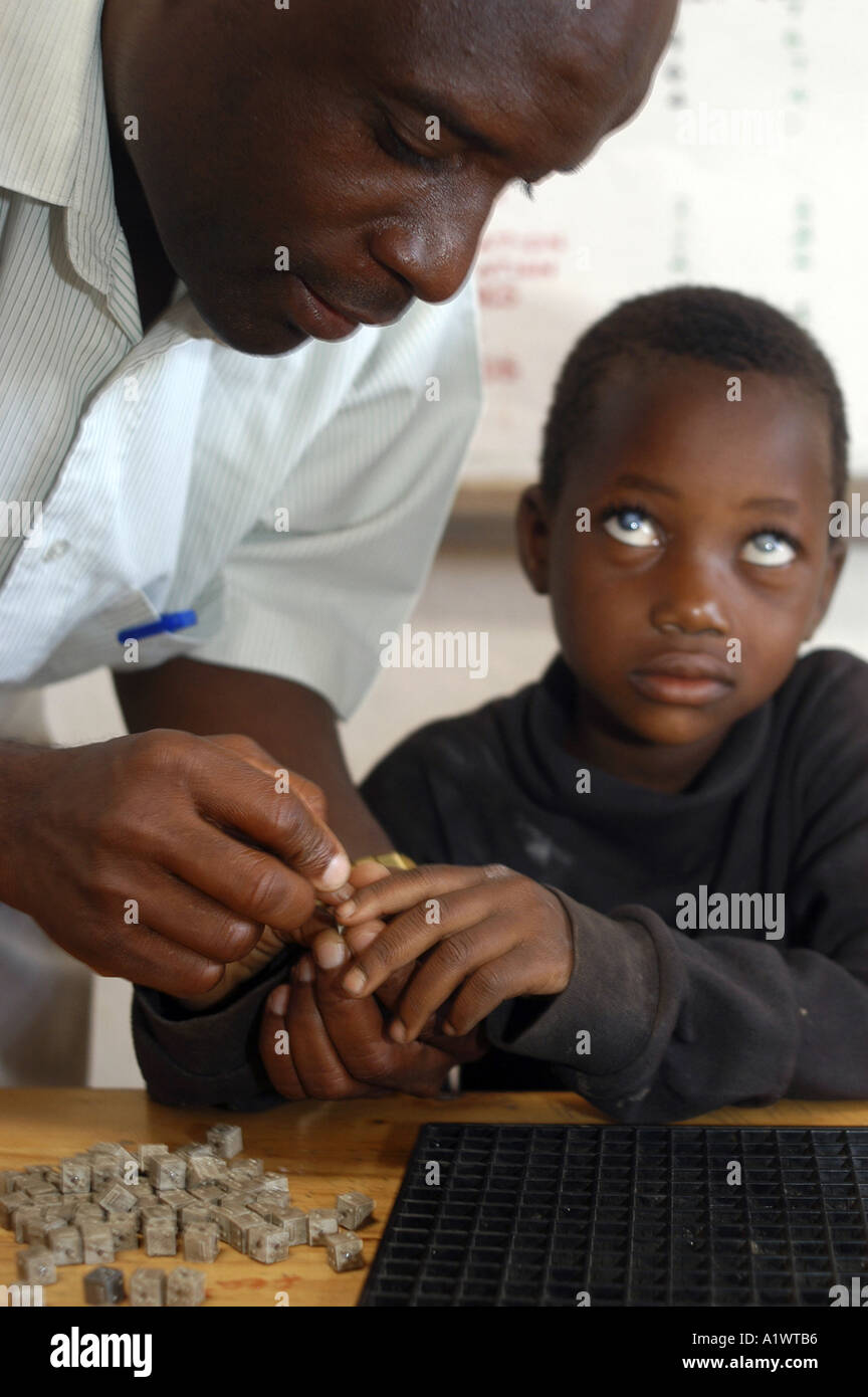 Blind Child Learning To Use Writing Frame Near Salima Stock Photo Alamy