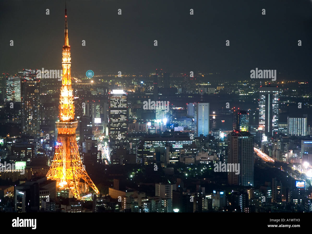 Tokyo Tower glows orange in a view from the Mori Tower at Roppongi ...