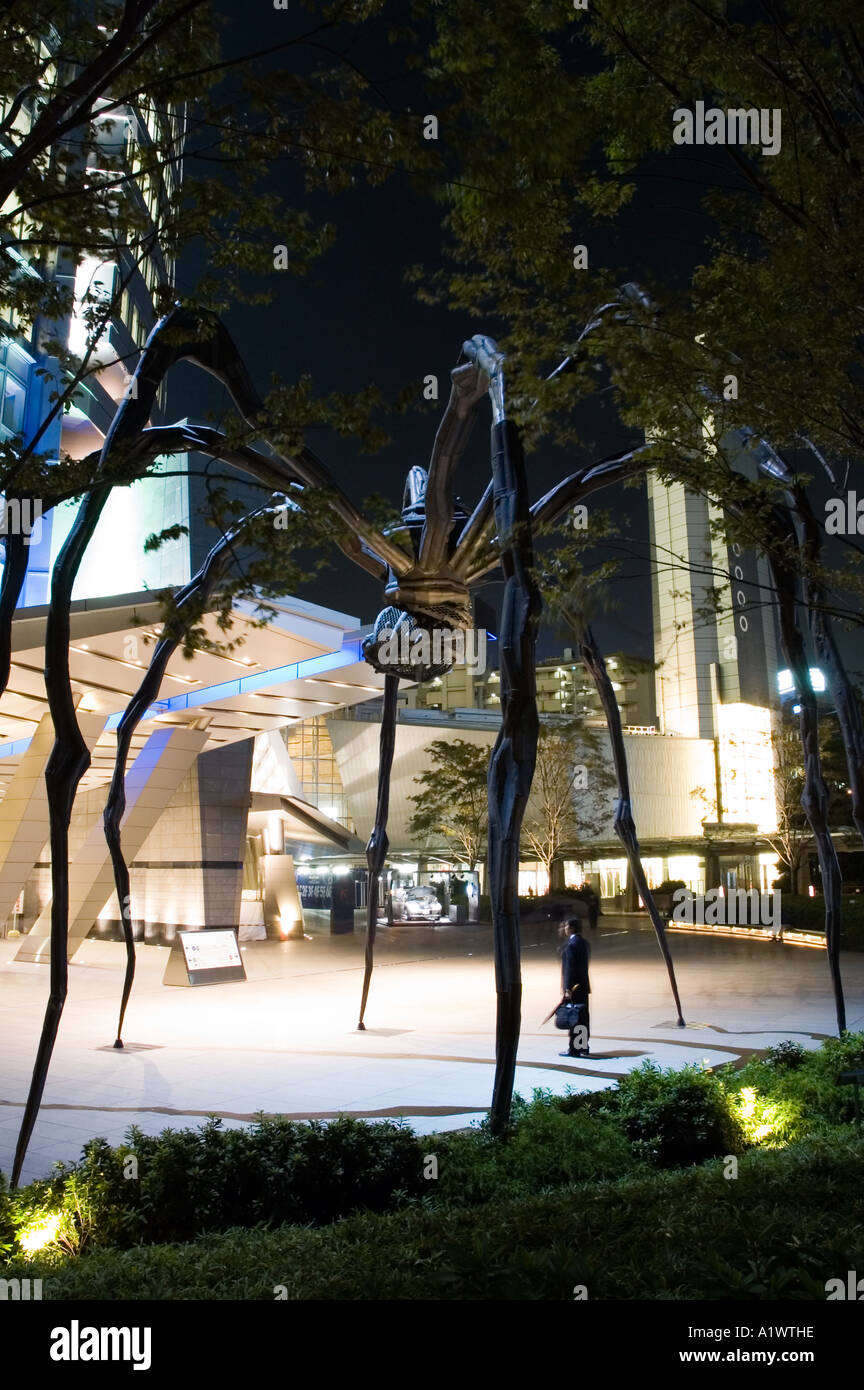 A sculpture of a spider stands in the center of the Roppongi Hills ...