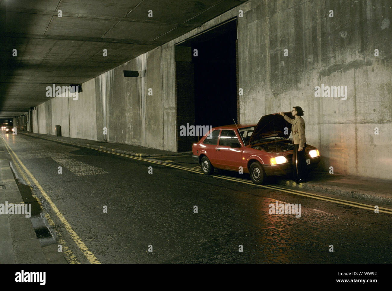 WOMAN ALONE AT CAR BREAKDOWN EAST LONDON Stock Photo - Alamy