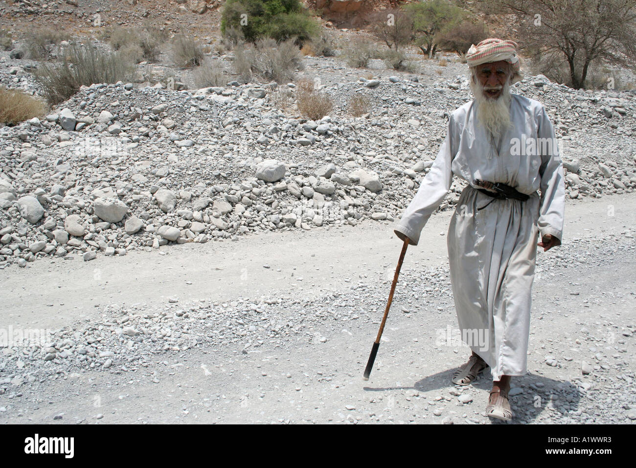 Old man hitching a ride, Oman Stock Photo - Alamy