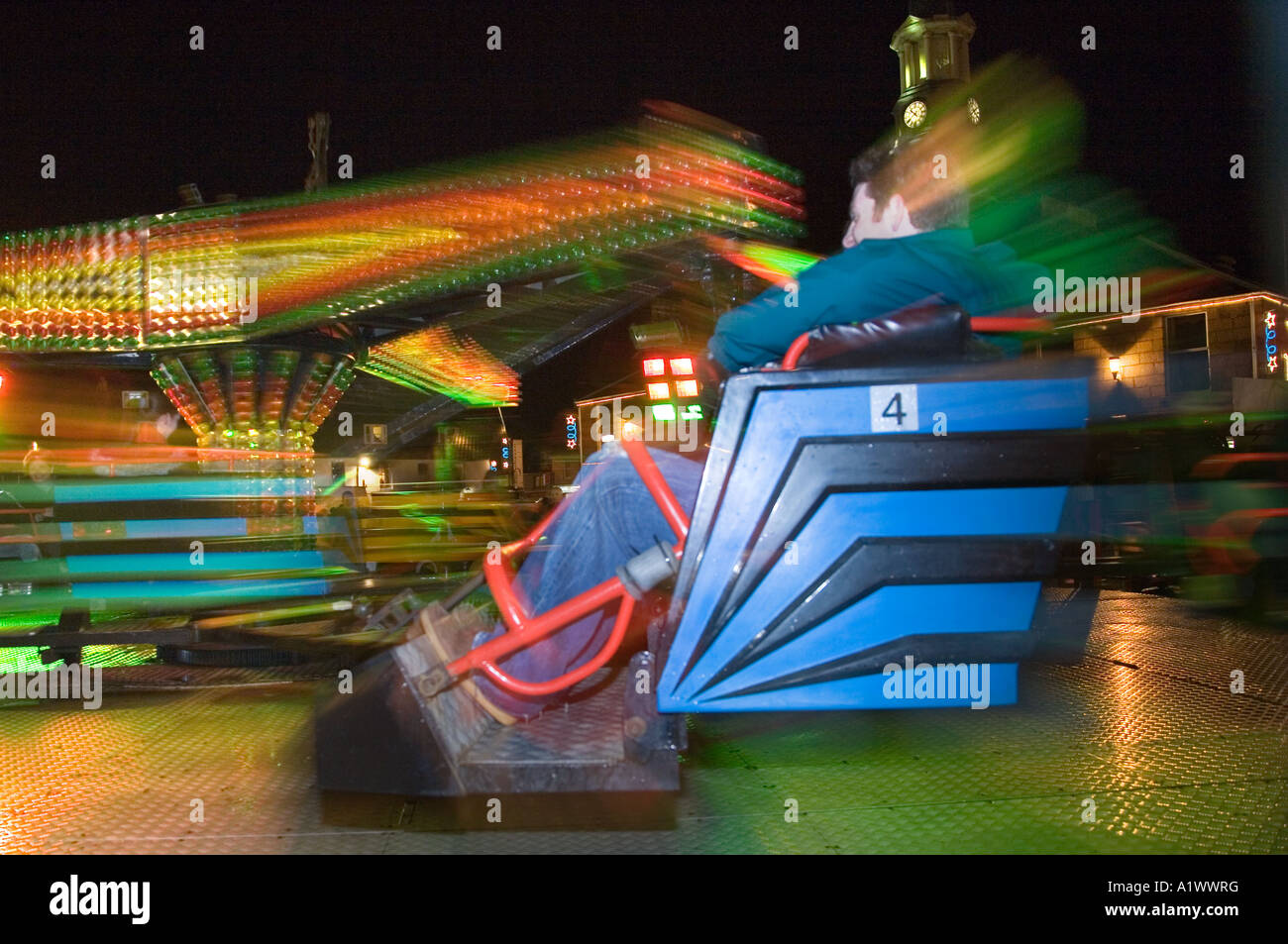 Cyclone Twist; Blurred riders on Faairground ride in Stonehaven ...