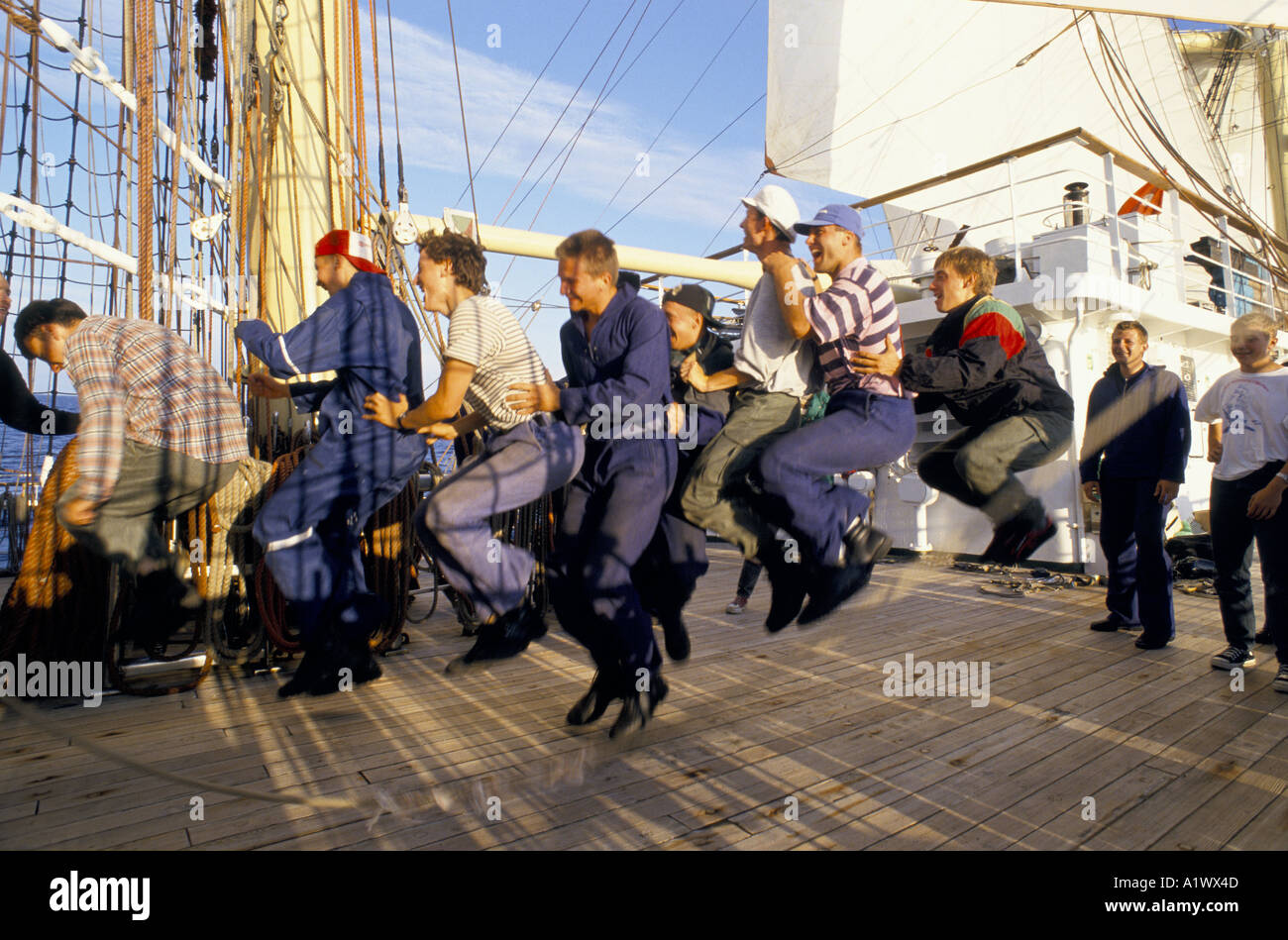 TALL SHIPS RACE 1994 EIGHT CREWMEN JUMPING TOGETHER WHILE SKIPPING ON ...