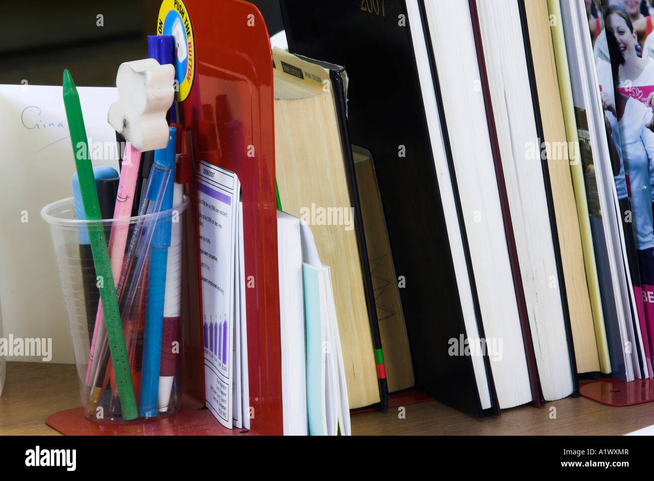 office books lined up on a desk Stock Photo - Alamy