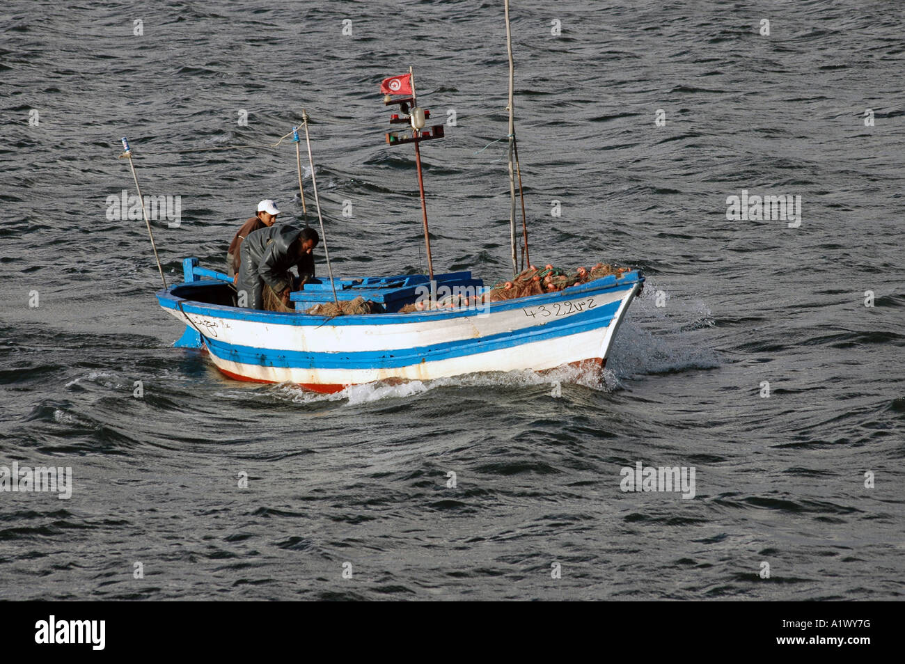 Fishing boat seeing from Ferry crossing from Ajim village on Djerba ...