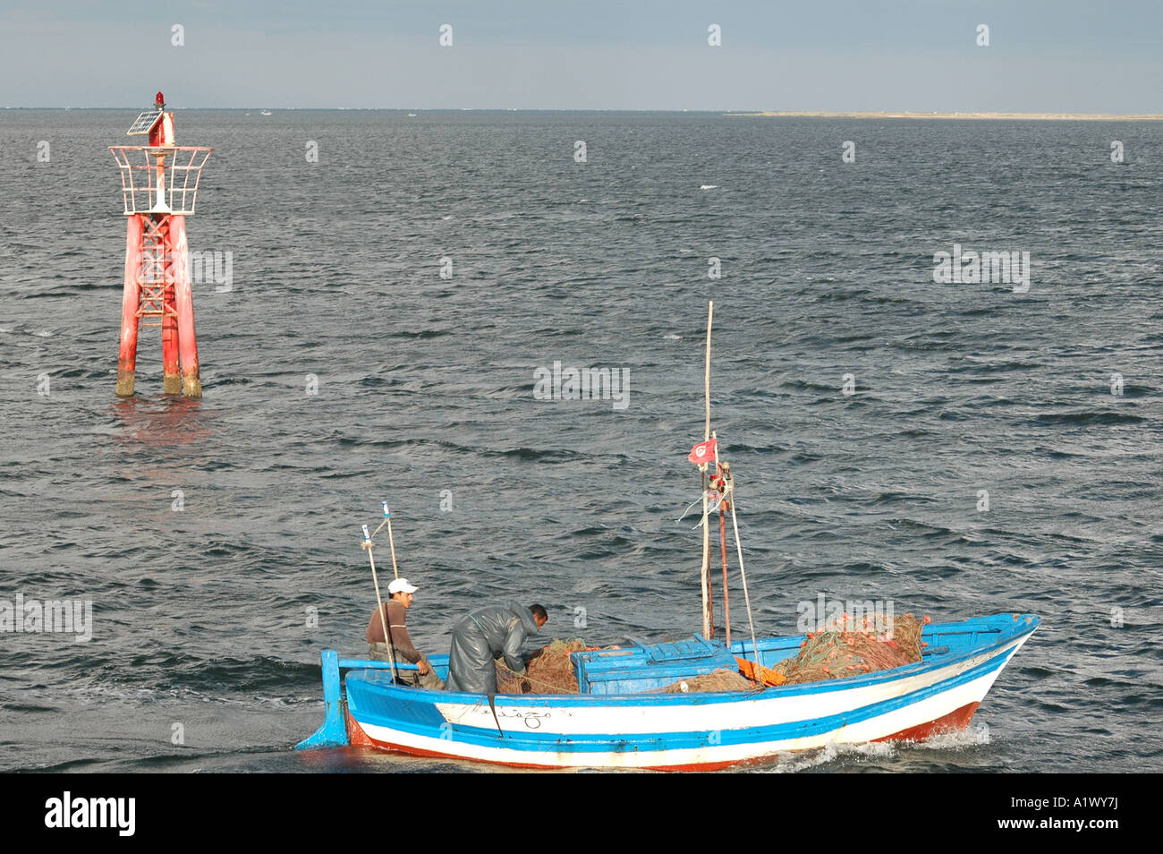 Fishing boat seeing from Ferry crossing from Ajim village on Djerba ...