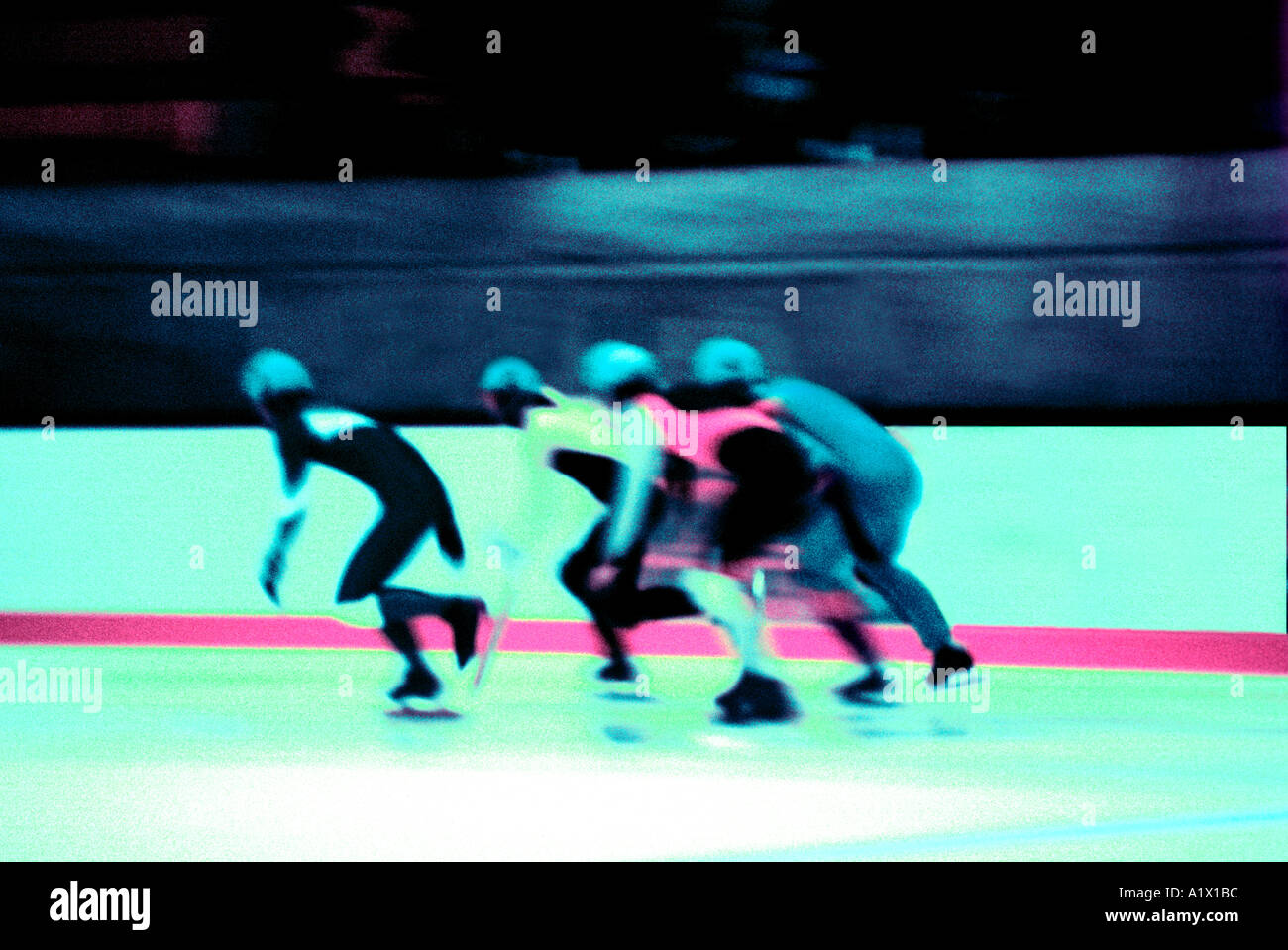 Speed skaters in group form Stock Photo - Alamy