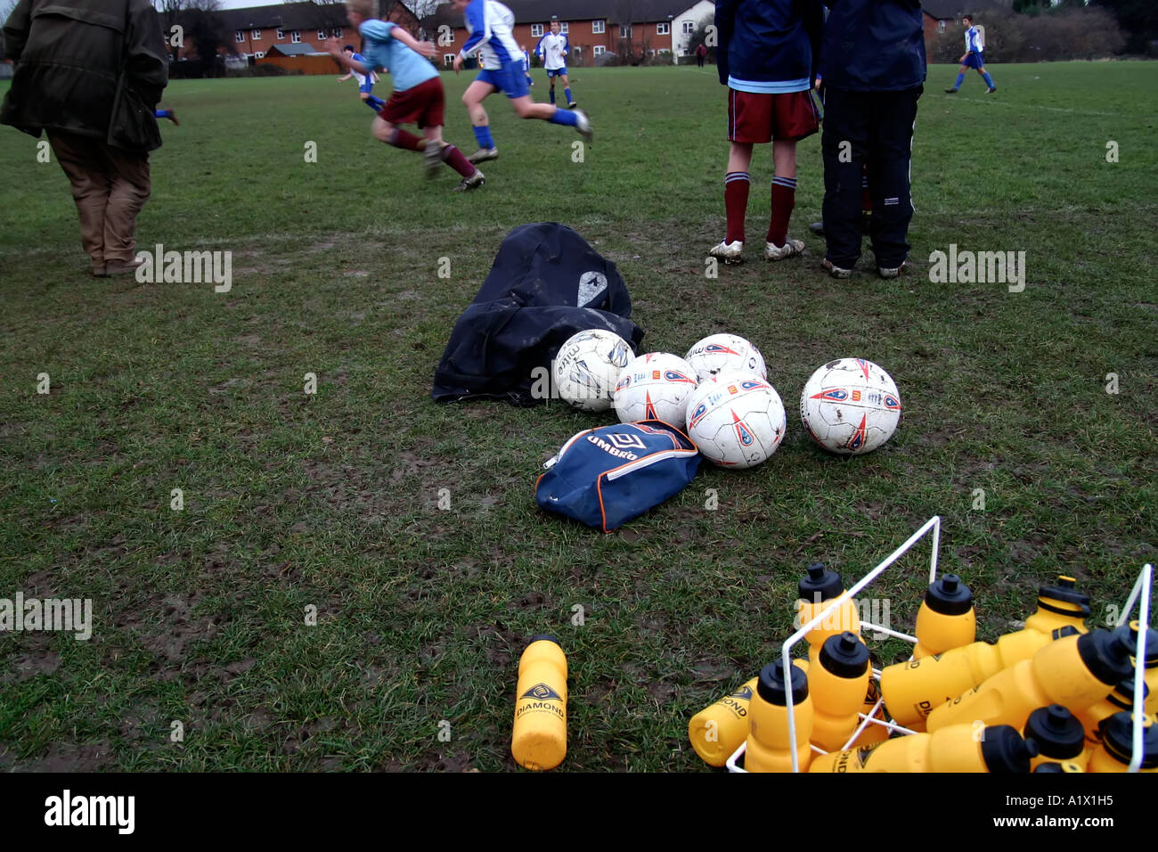 Spare footballs and drinks bottles by side of pitch during local ...