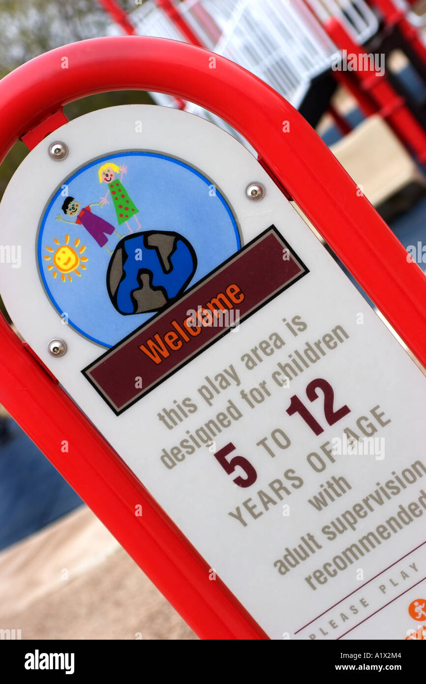 Playground warning sign Stock Photo - Alamy