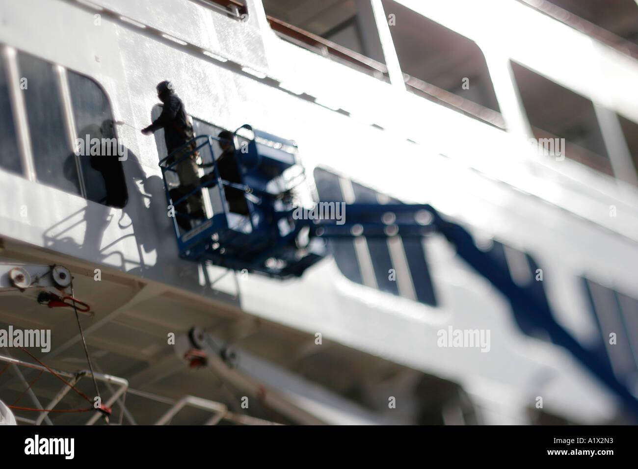 window washers working on a cruise ship Stock Photo - Alamy