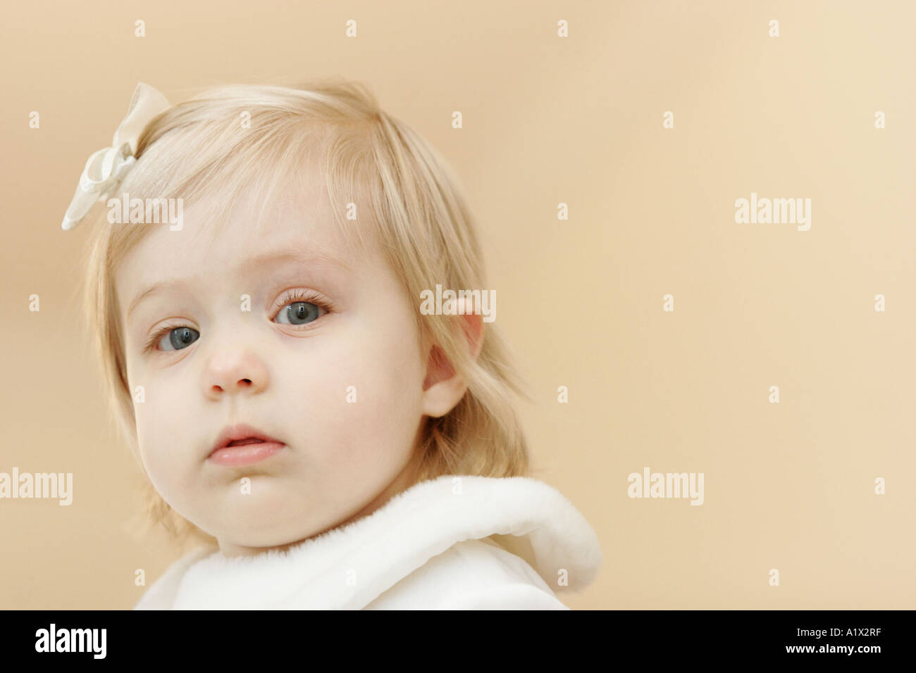 close up portrait of baby girl with ribbon in hair Stock Photo - Alamy