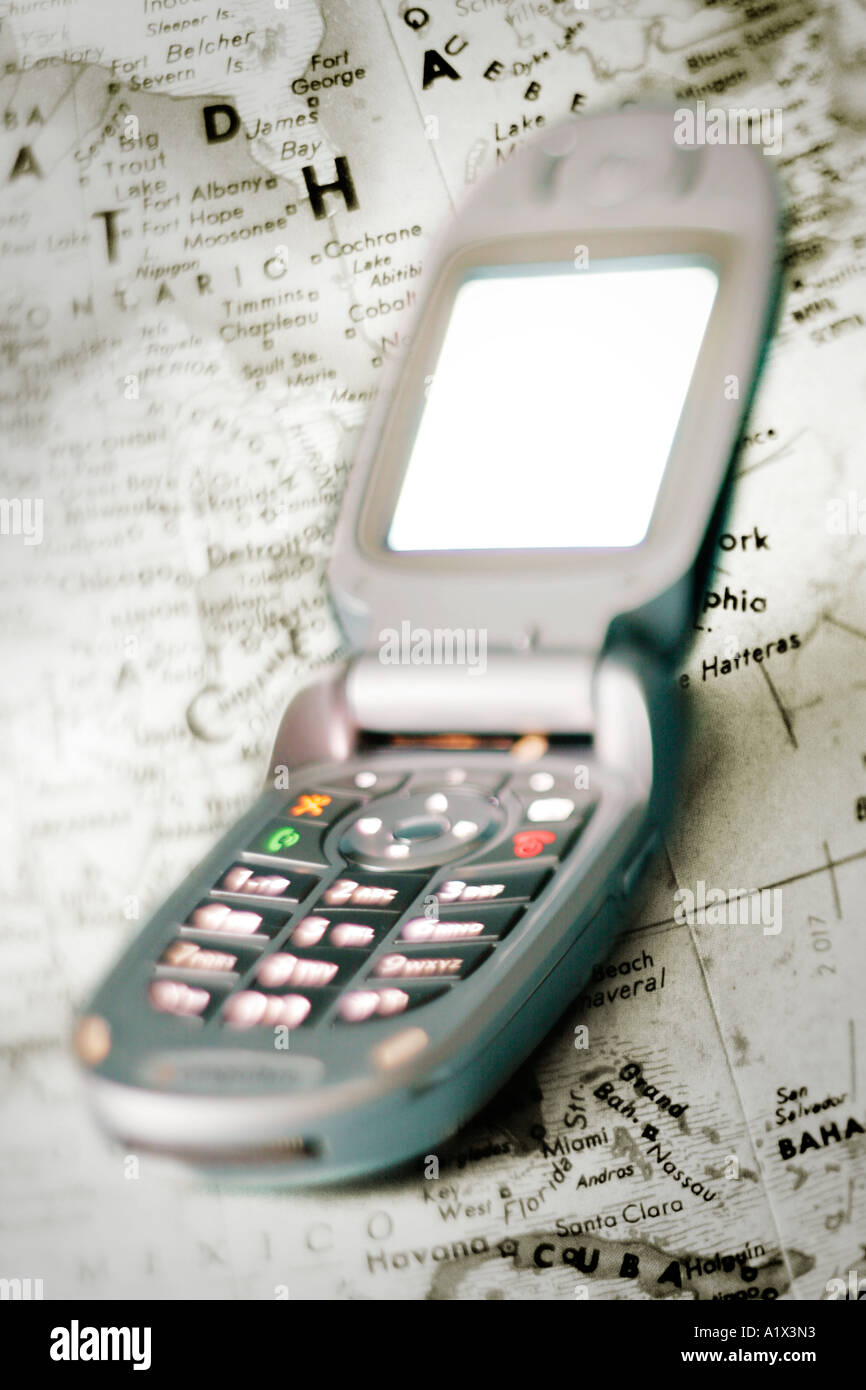 digital composition of flip cell phone and map or atlas Stock Photo - Alamy