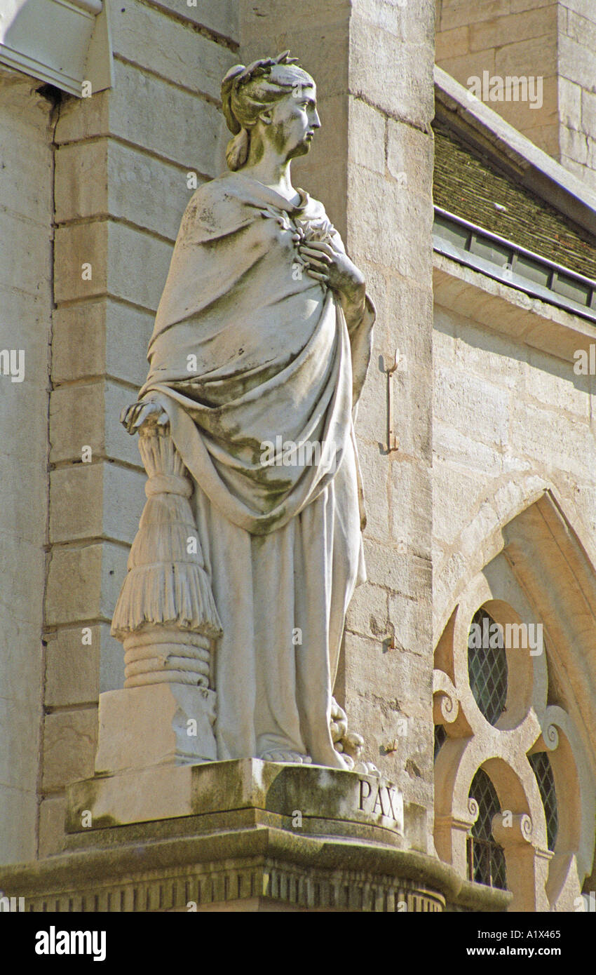 Statue standing outside the basilica de Notre Dame in the historic old ...