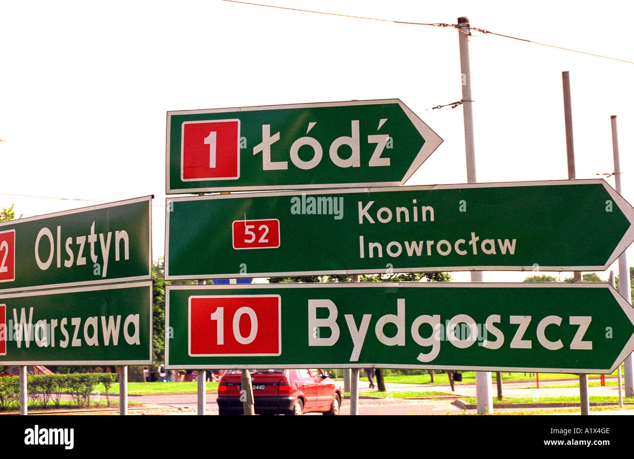 Multiple directional signs by freeway. Lodz Poland Stock Photo - Alamy