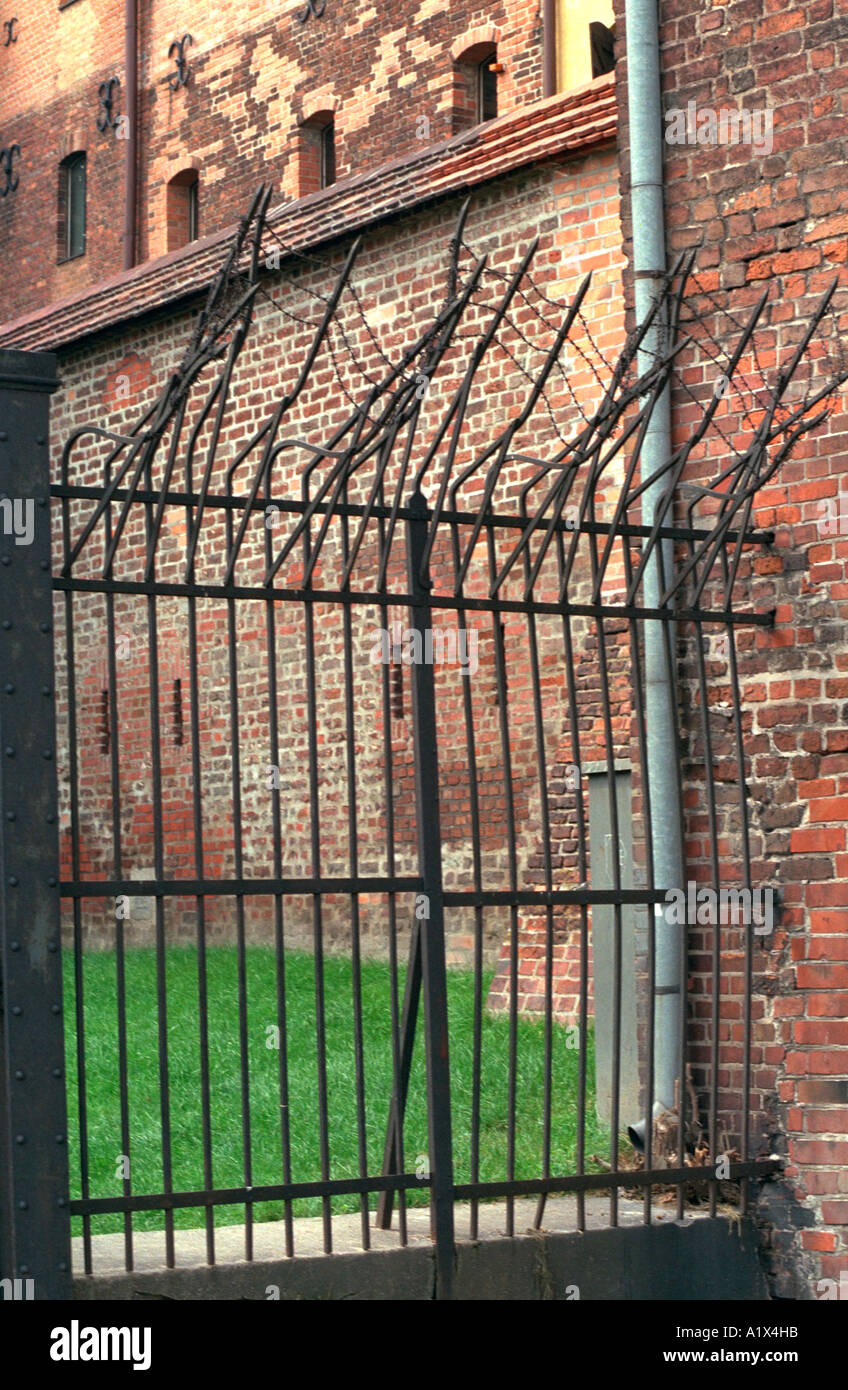 Castle wall and barbed wire security gate. Torun Poland Stock Photo - Alamy