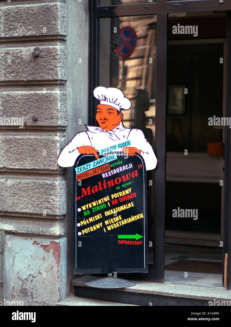 Outdoor sign with chef advertising the Raspberry Restaurant. Lodz ...