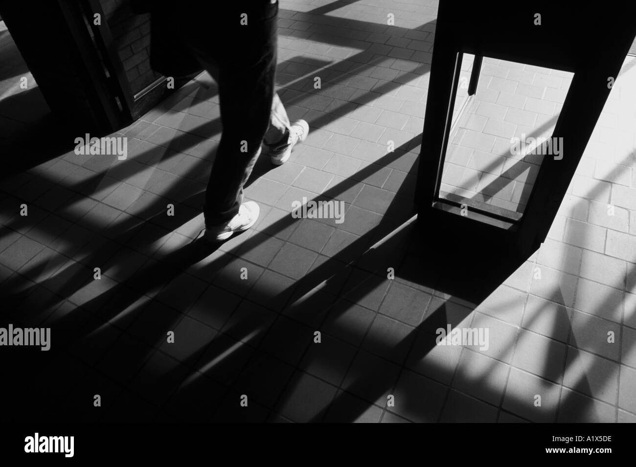 Office entryway door doorway with person feet walking by Stock Photo ...