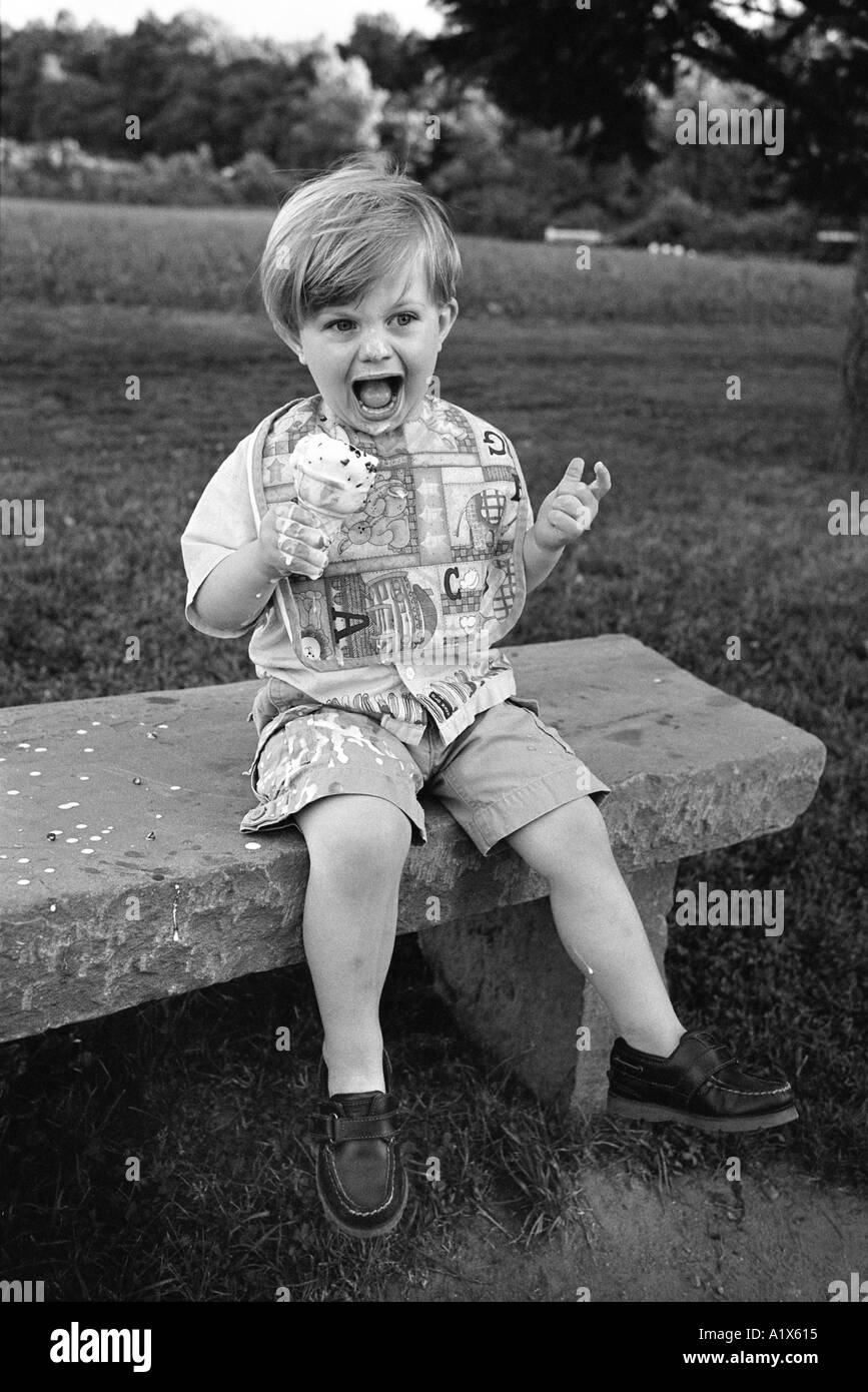 Funny kid eating Black and White Stock Photos & Images - Alamy