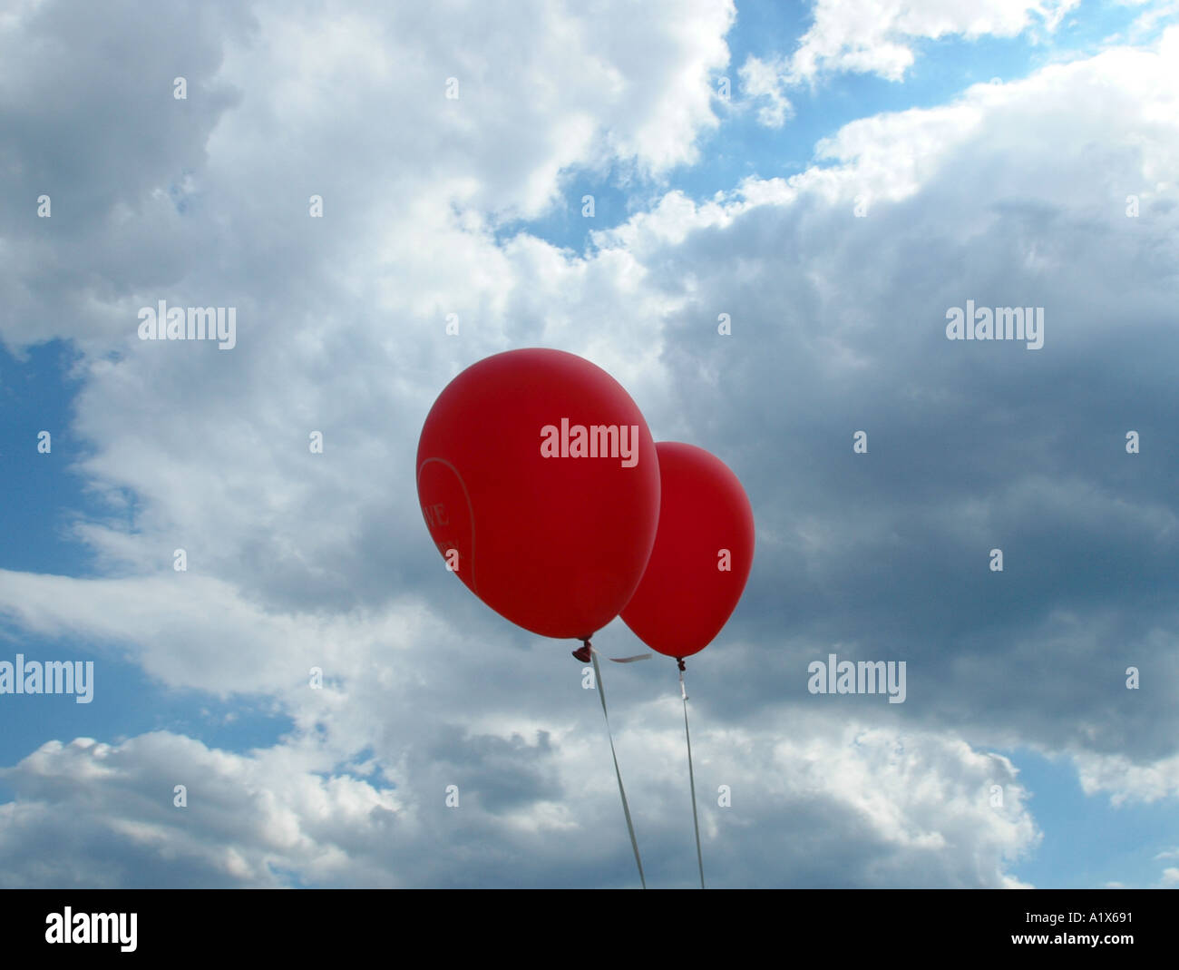 two red ballons in sky at a celebration fair Stock Photo - Alamy