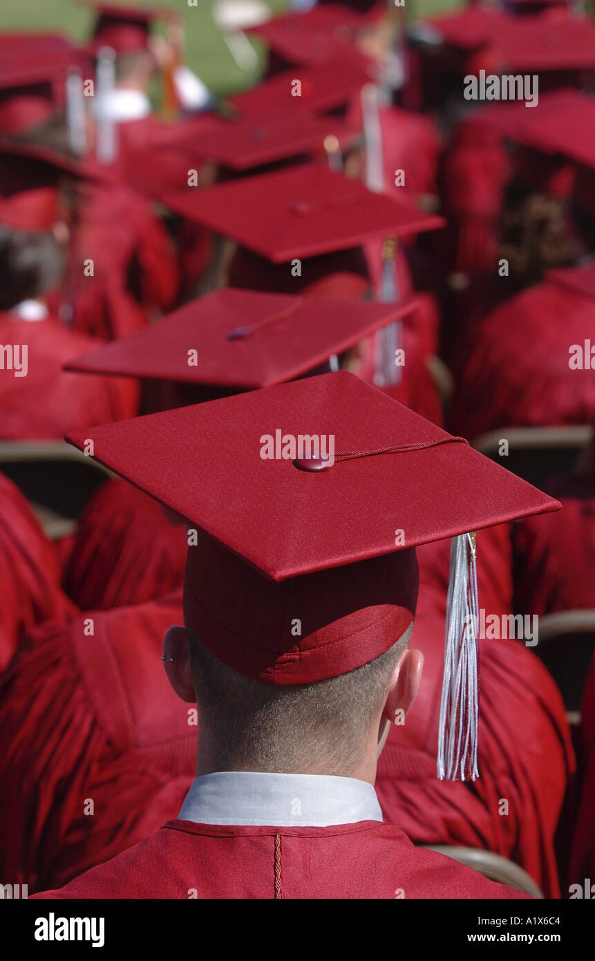 Graduates from rear vertical wearing caps and gowns during commencement ...