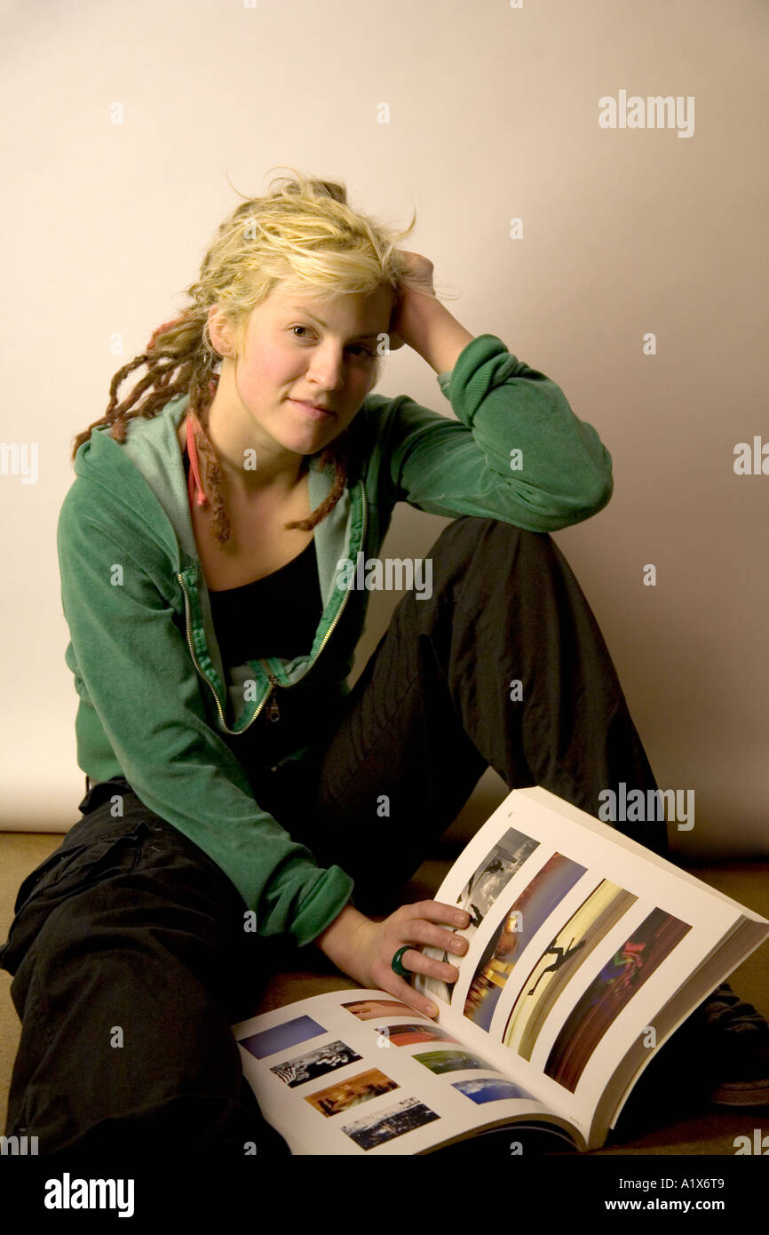 Looking at book Stock Photo - Alamy