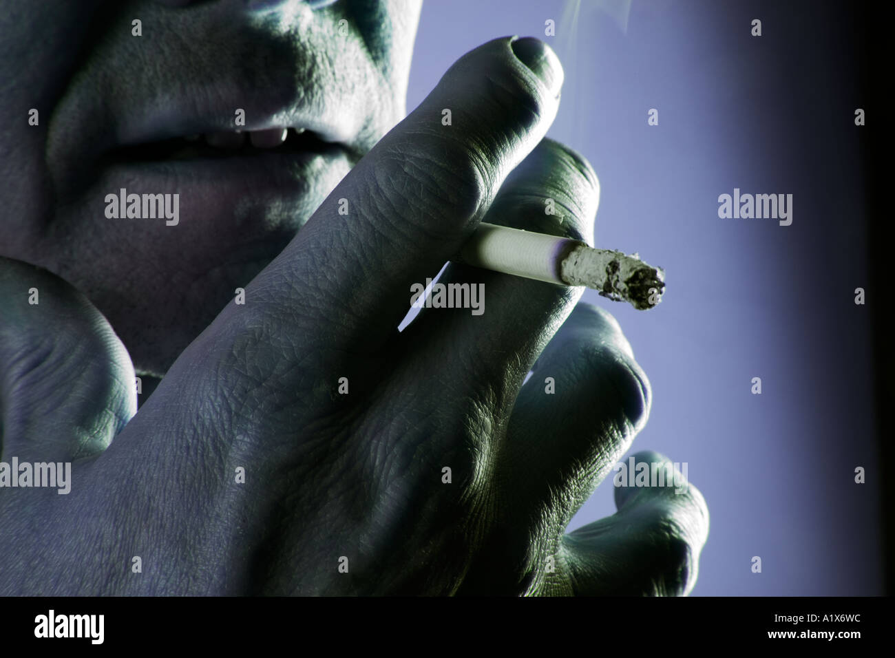 Man smoking cigarette between hi-res stock photography and images - Alamy