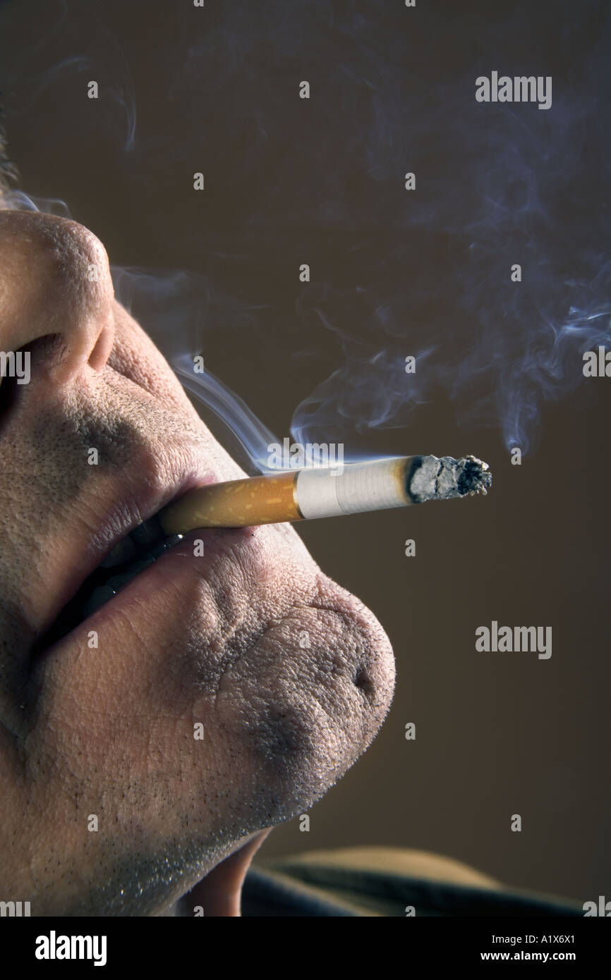 Cigarette between lips hi-res stock photography and images - Alamy