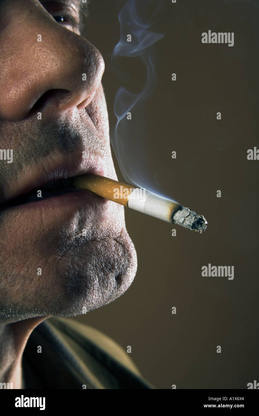 Man smoking cigarette between hi-res stock photography and images - Alamy