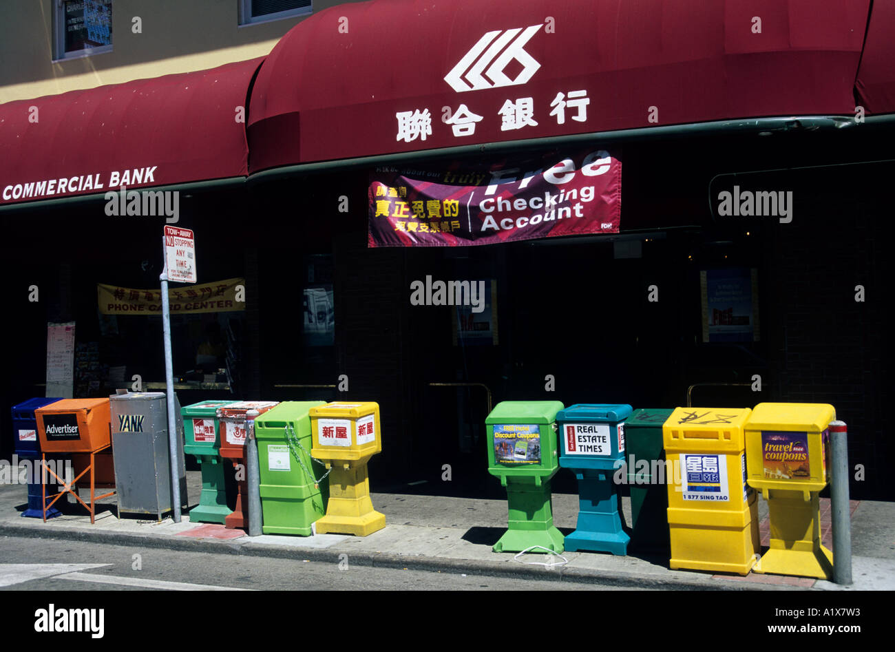 News stand vending machines outside bank with bilingual English and ...