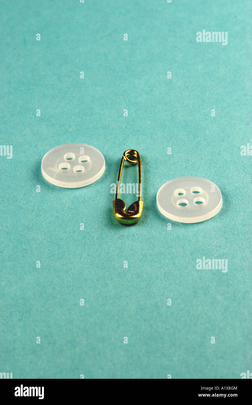 knobs and safety pin Stock Photo - Alamy